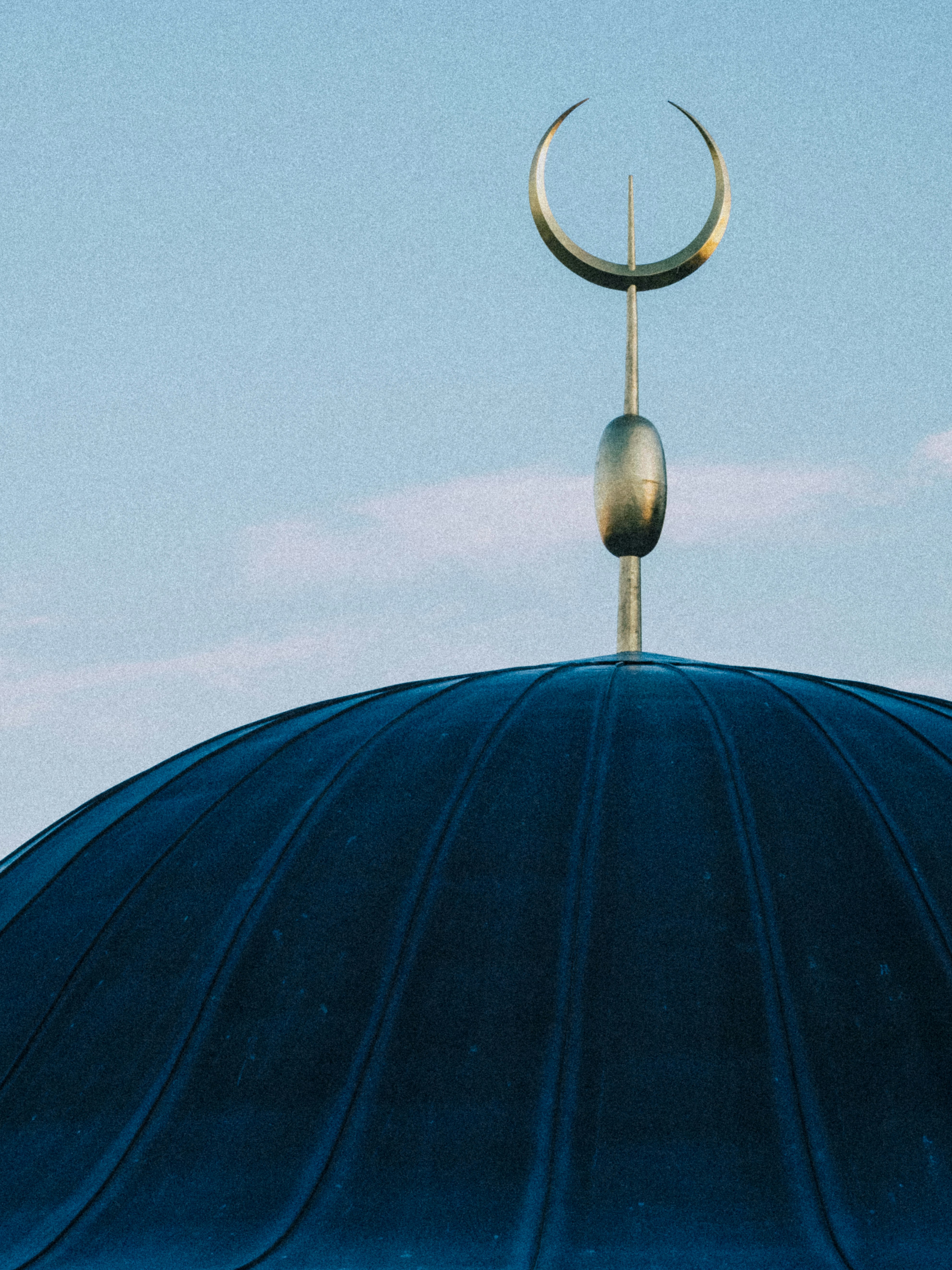 Crescent Spire: A Dome and Crescent Crowned Under a Quiet Sky