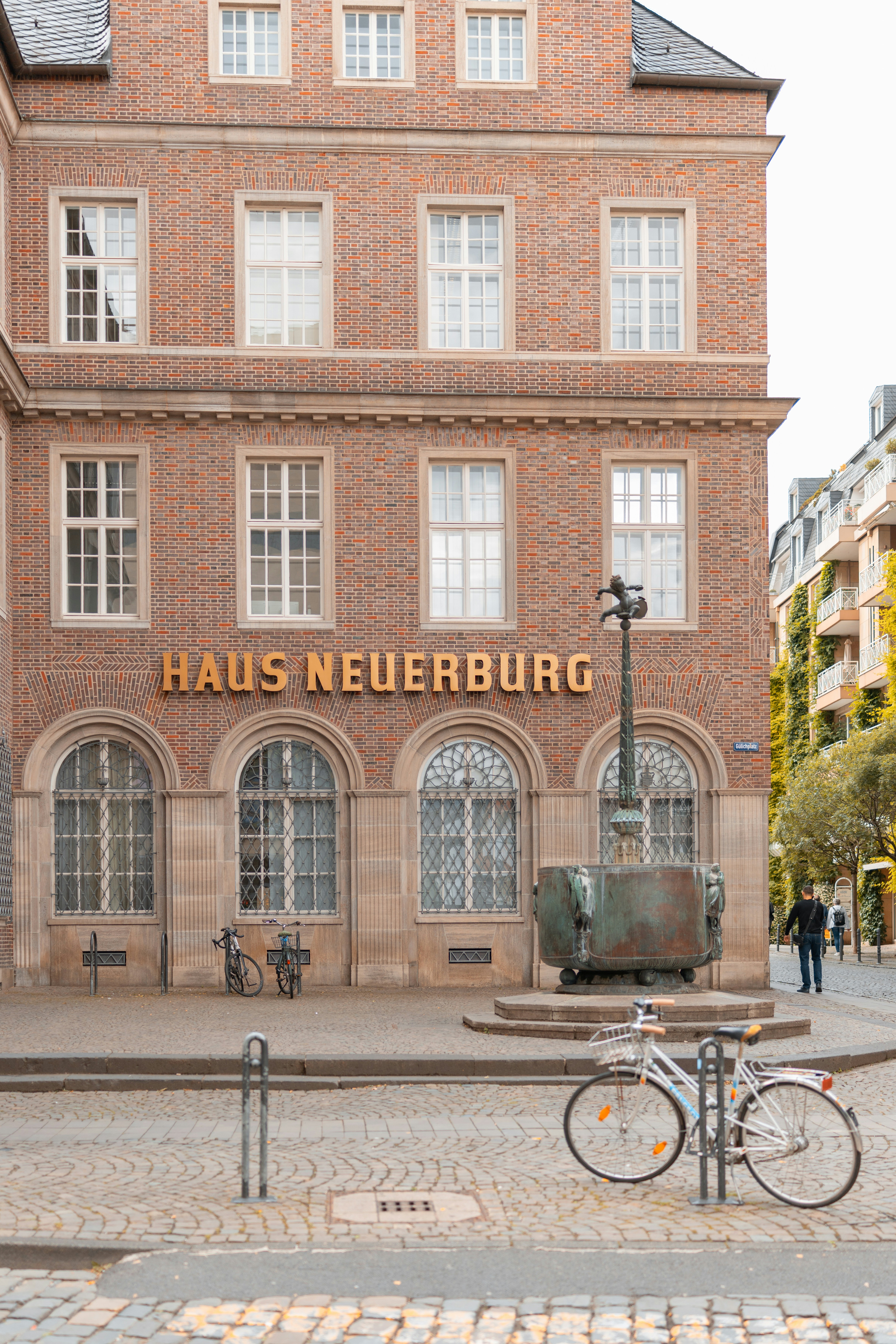 Haus Neuerburg: Brick Facade, Street Scene and Bicycle Garden