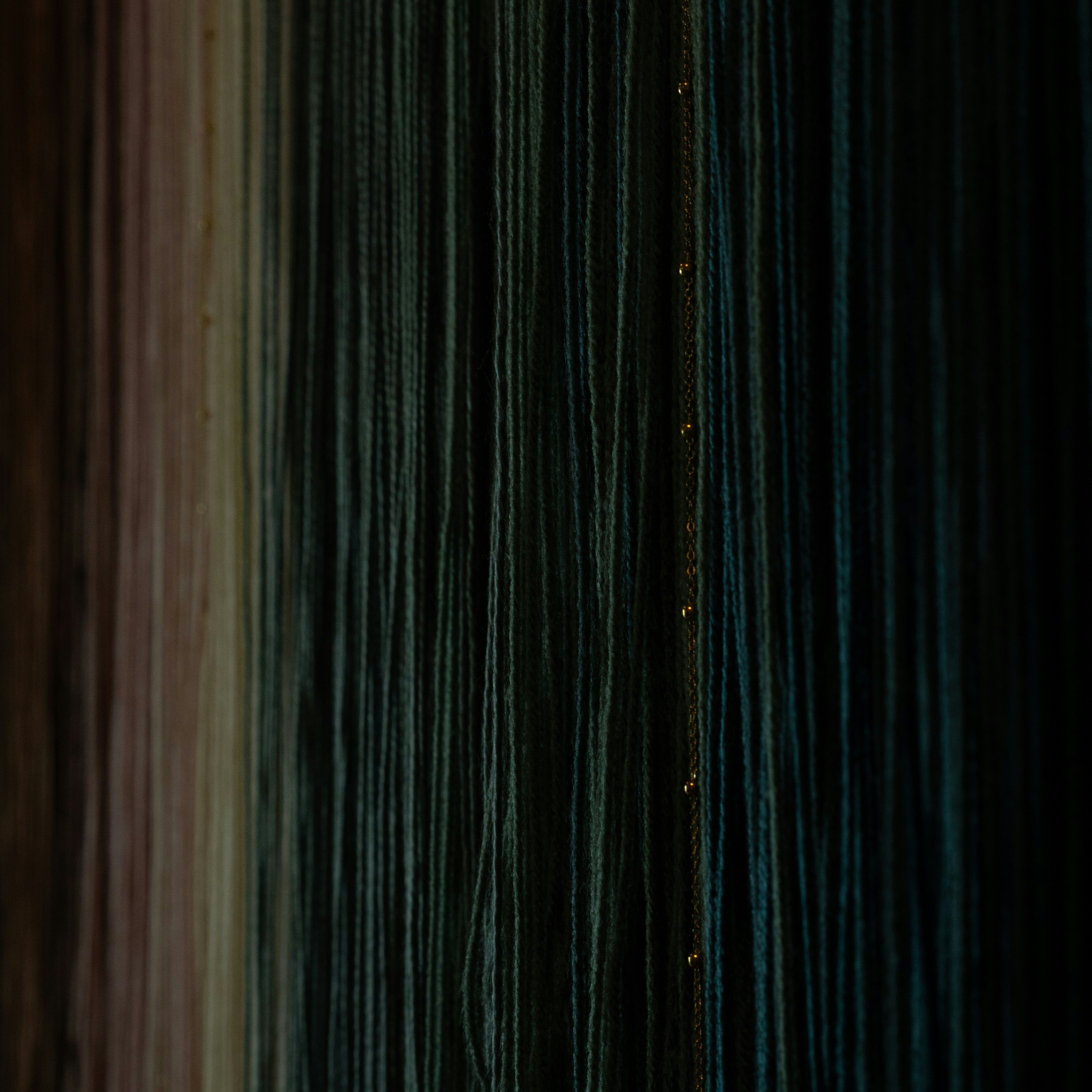 Vertical Velvet: Strands of Color in the Dark Curtain