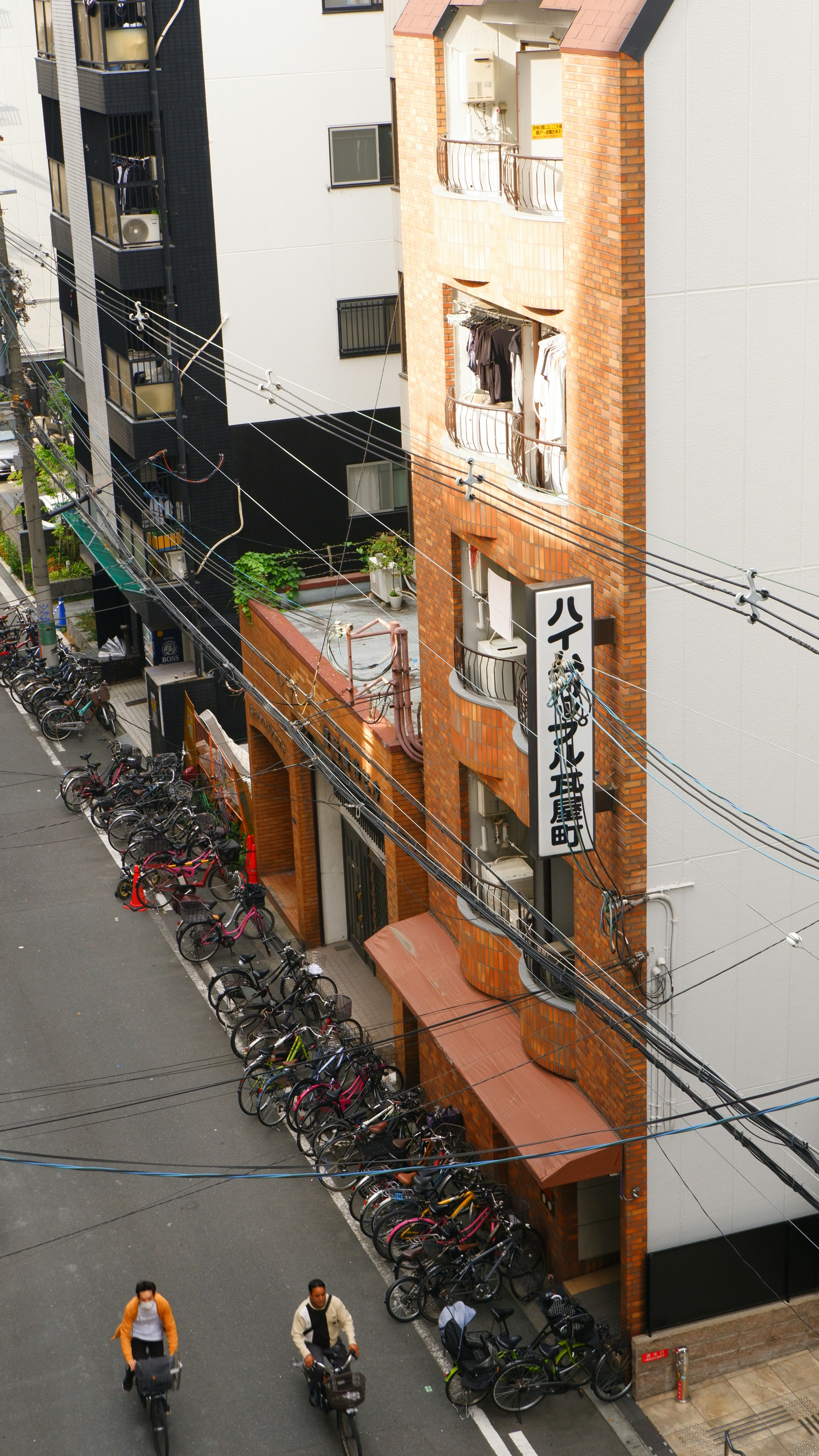 Urban Spiral: Bicycles, Wires, and Brick Facades