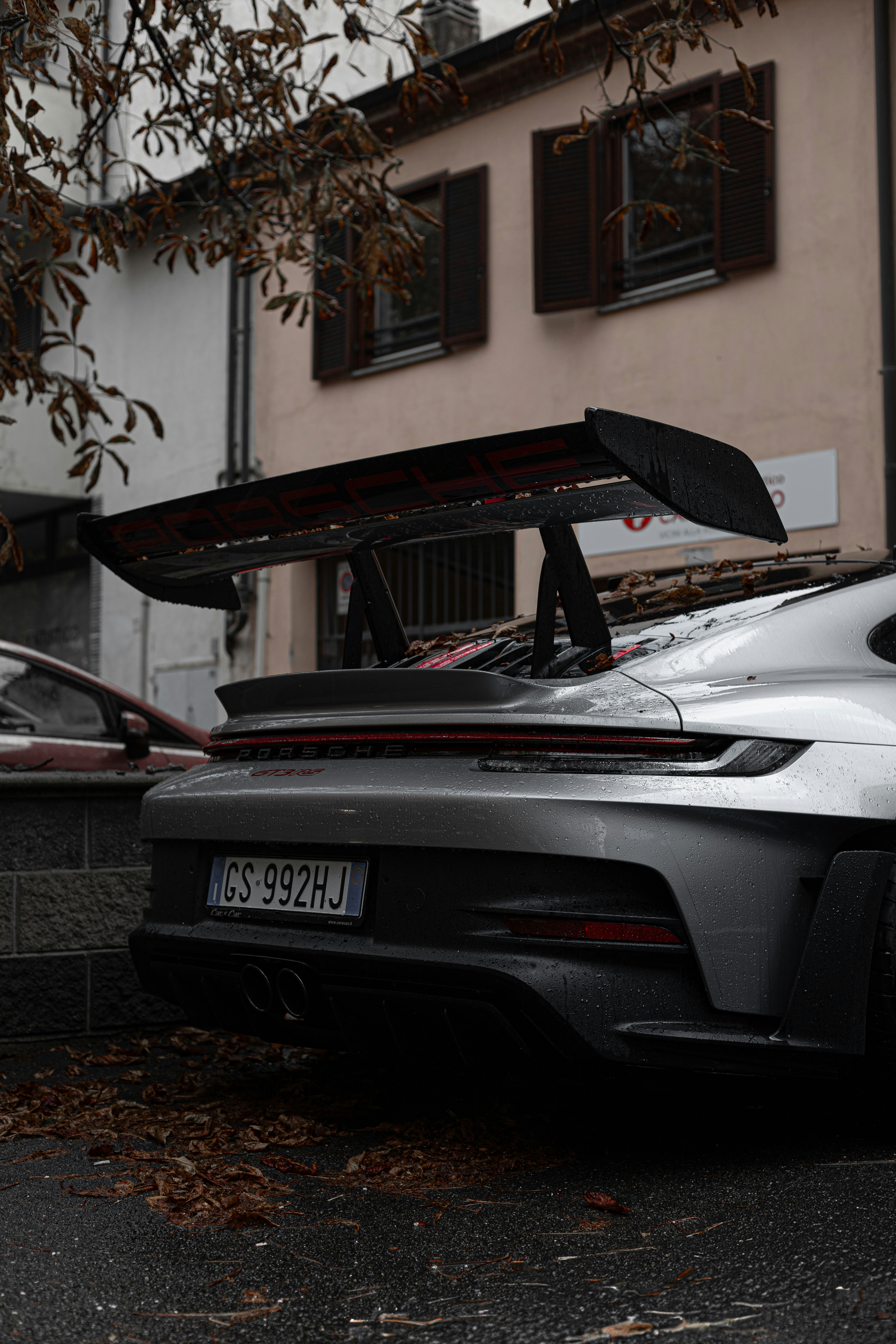 Rear Spoiler Silence: Porsche Purity in a Rainy Street Scene