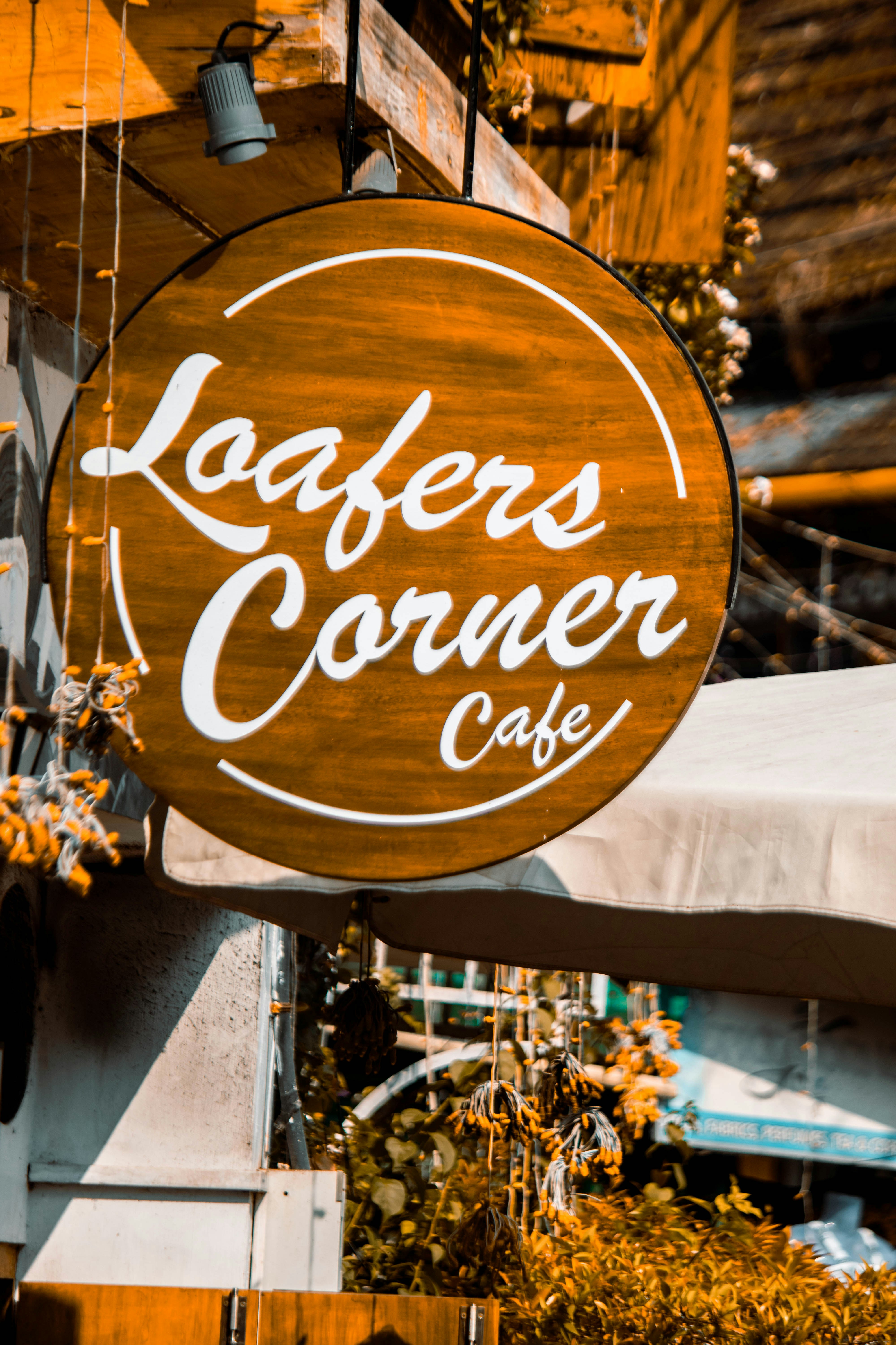 Loafers Corner: A Circular Sign Radiating Warm Café Charm