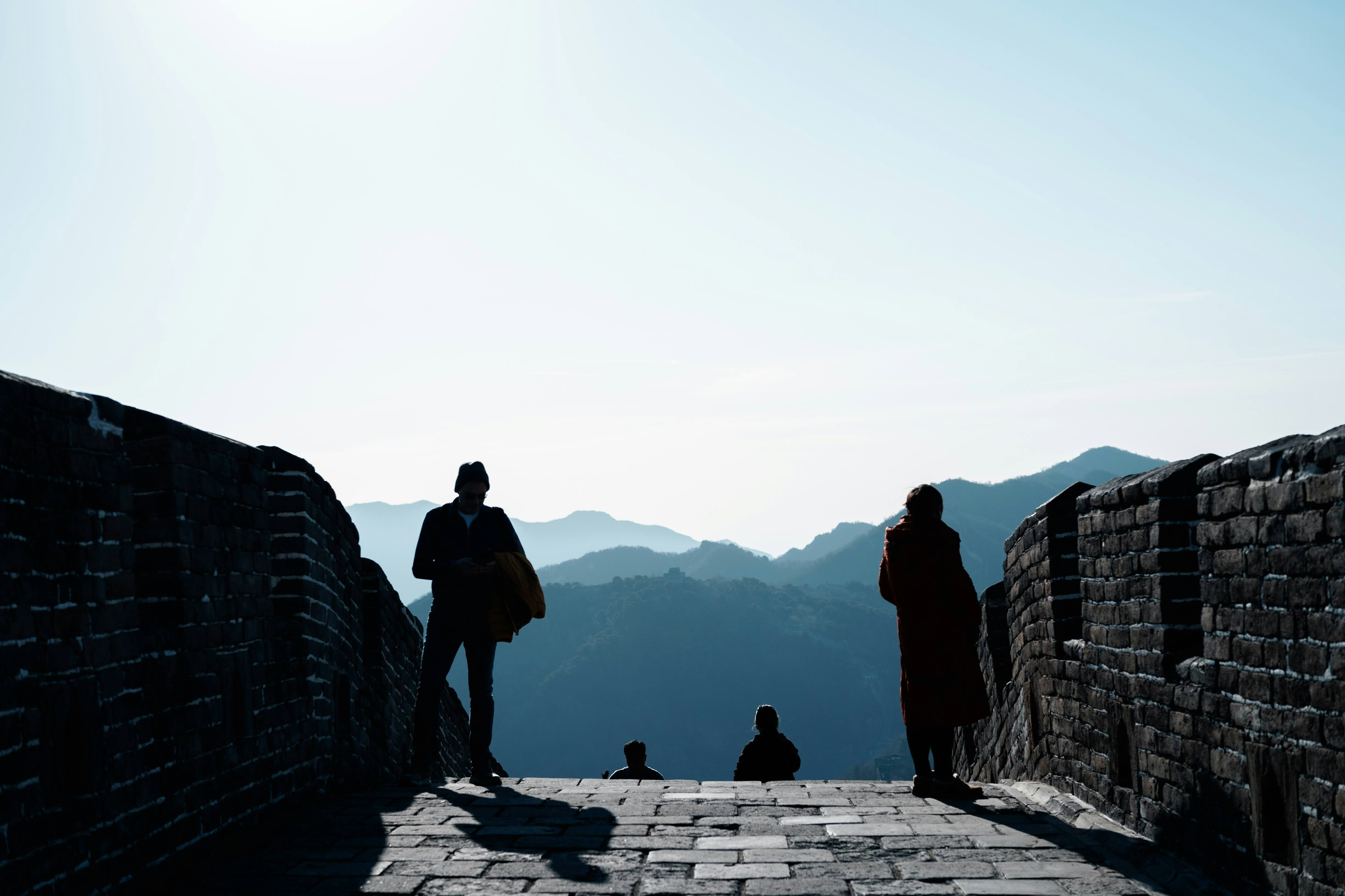 Borders of Sky and Stone: silhouettes atop an ancient rampart