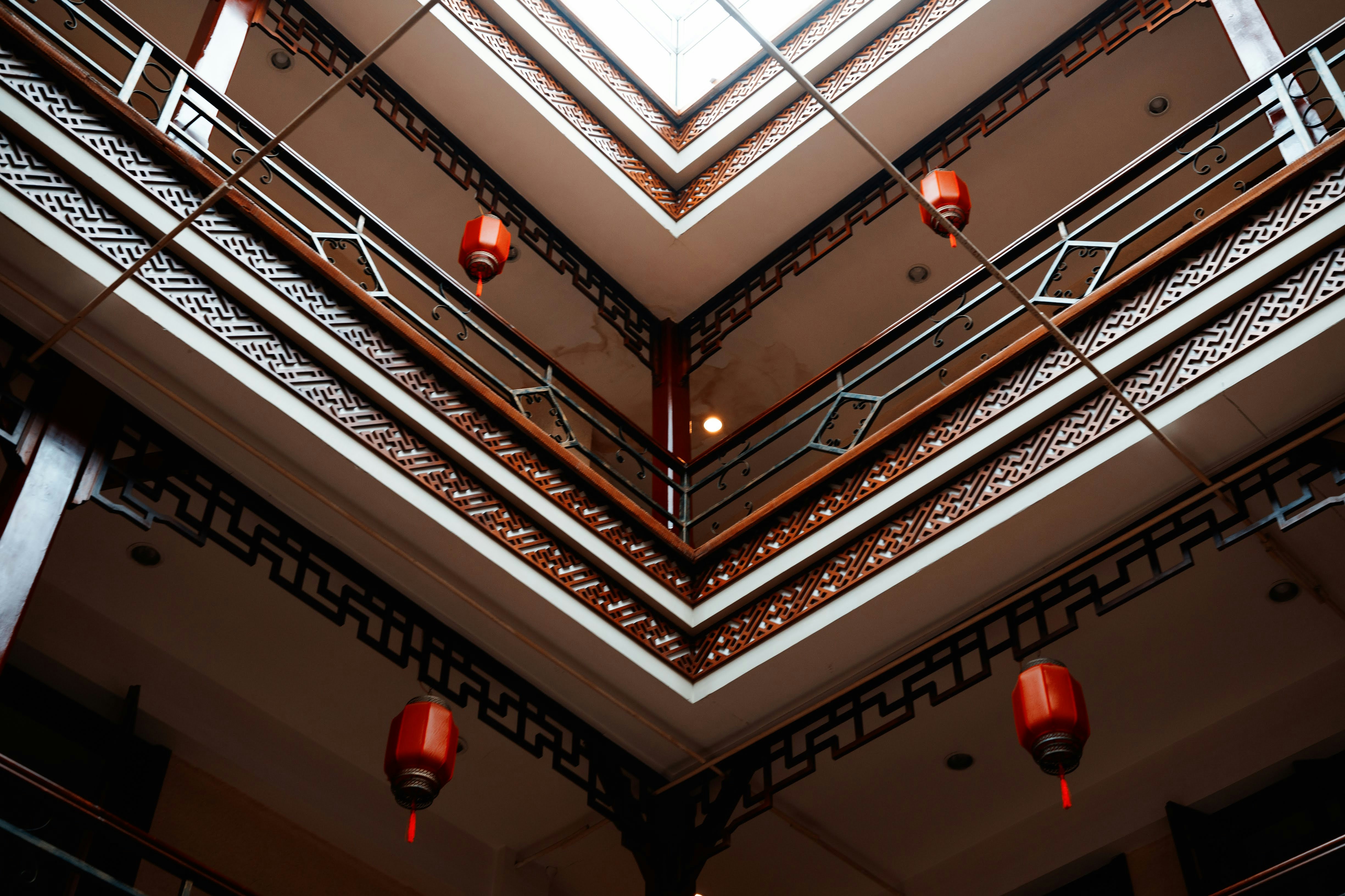 Geometric Atrium: Lanterns Framing the Central V-Vertex
