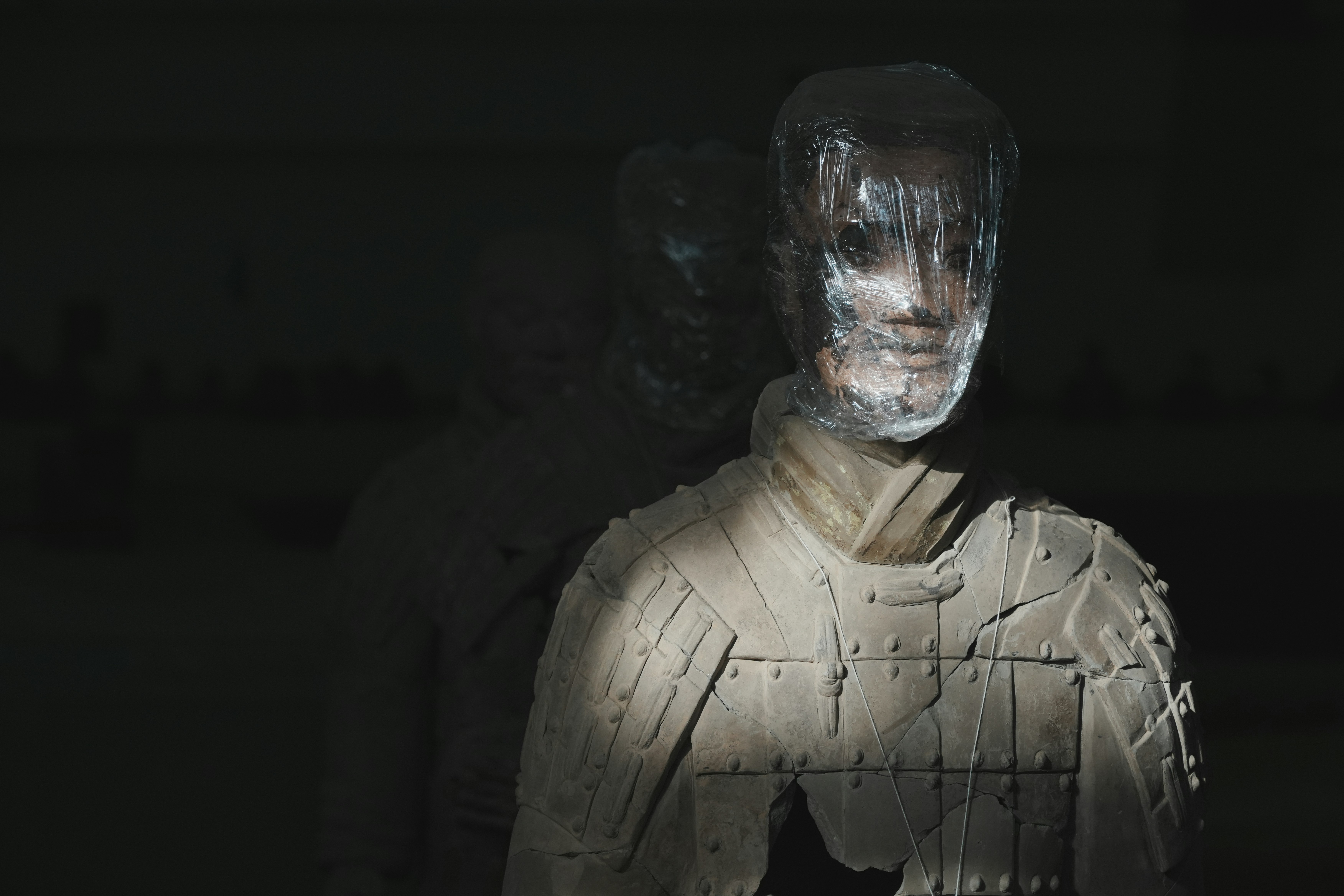 Shrouded Sentinel: A Gloved Figure in a Shadowed Armory