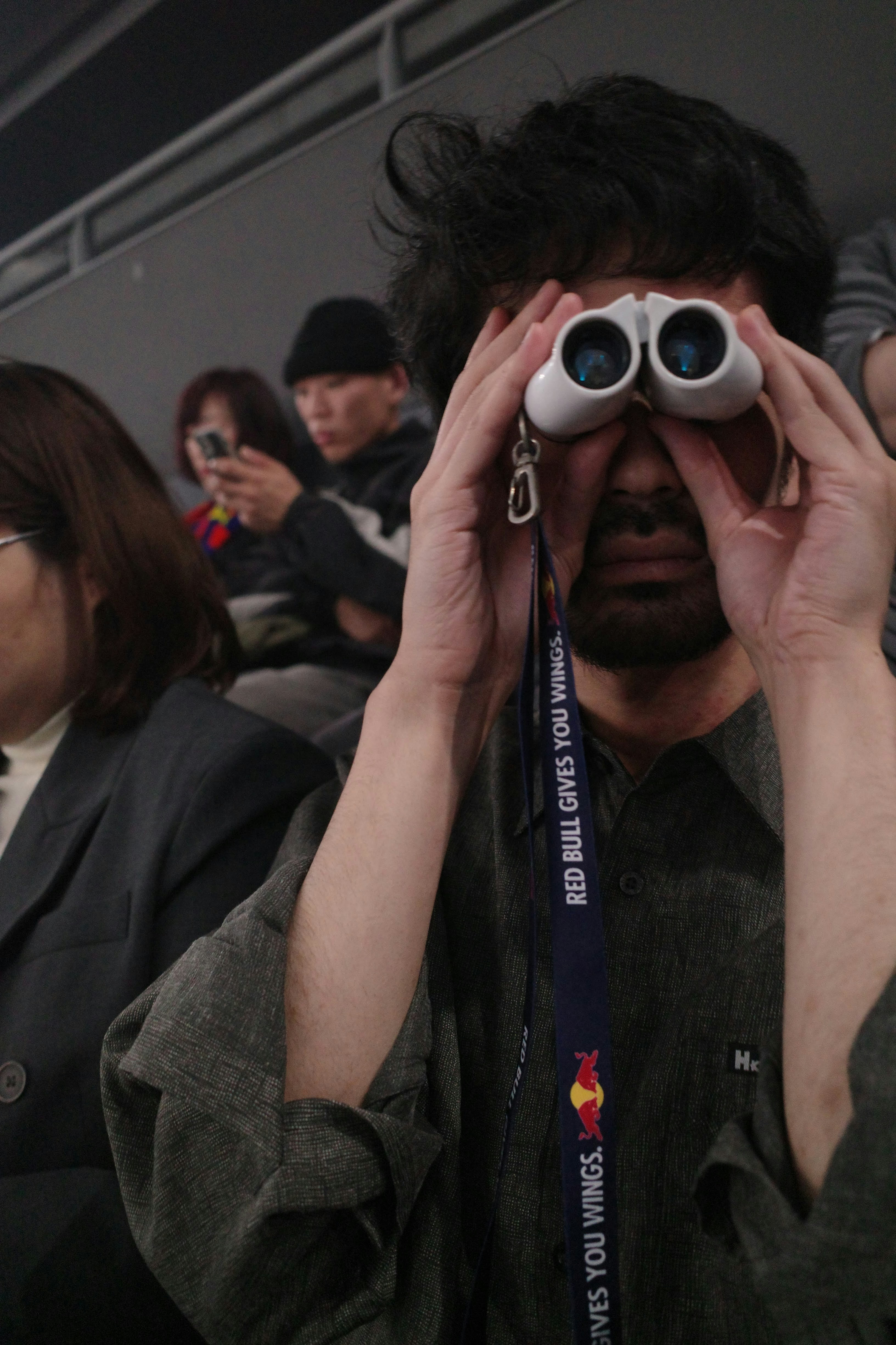 Binocular Spotlight: Man with White Binoculars at the Event