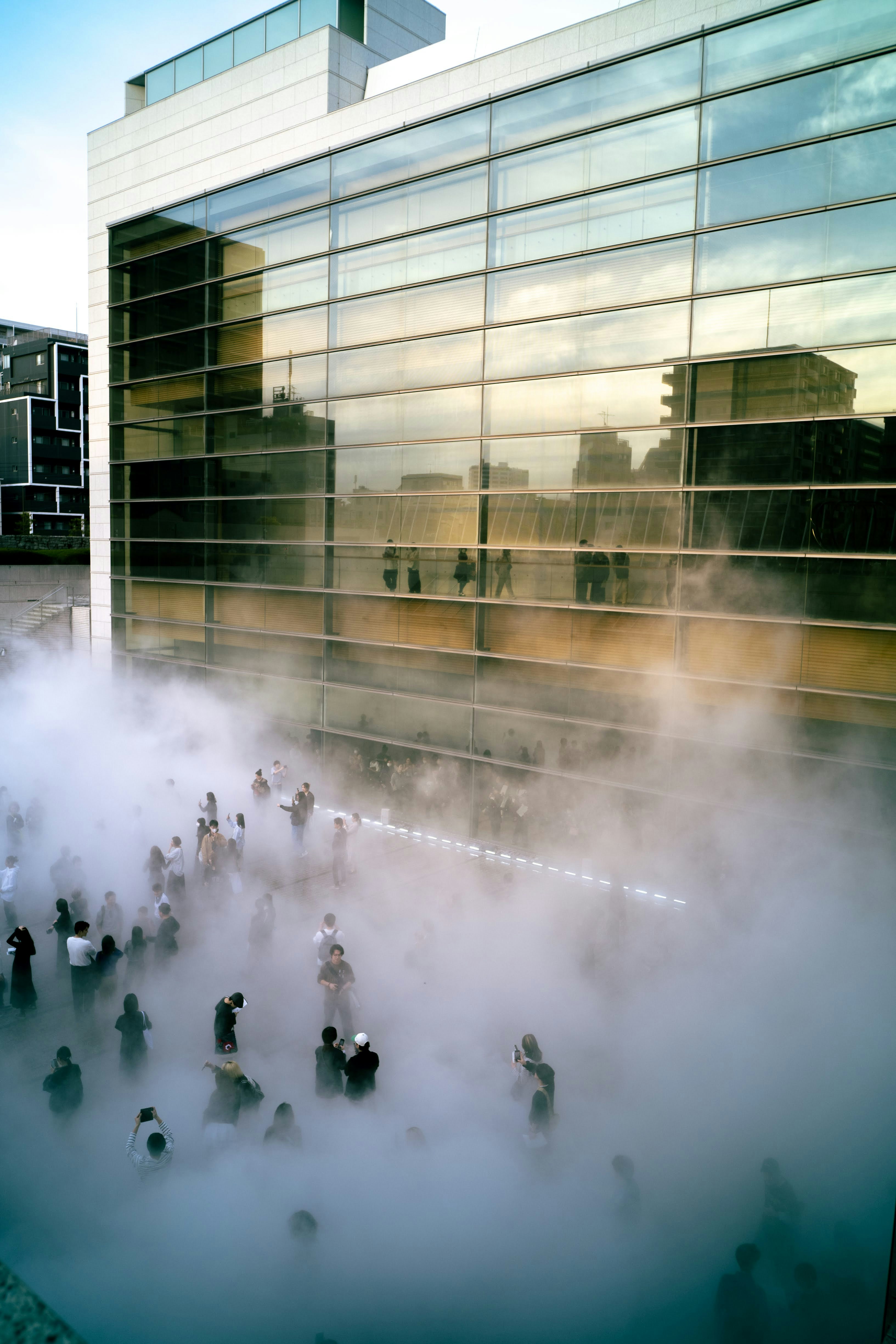 Fog over the Glass Atrium: People as Ghostly Silhouettes