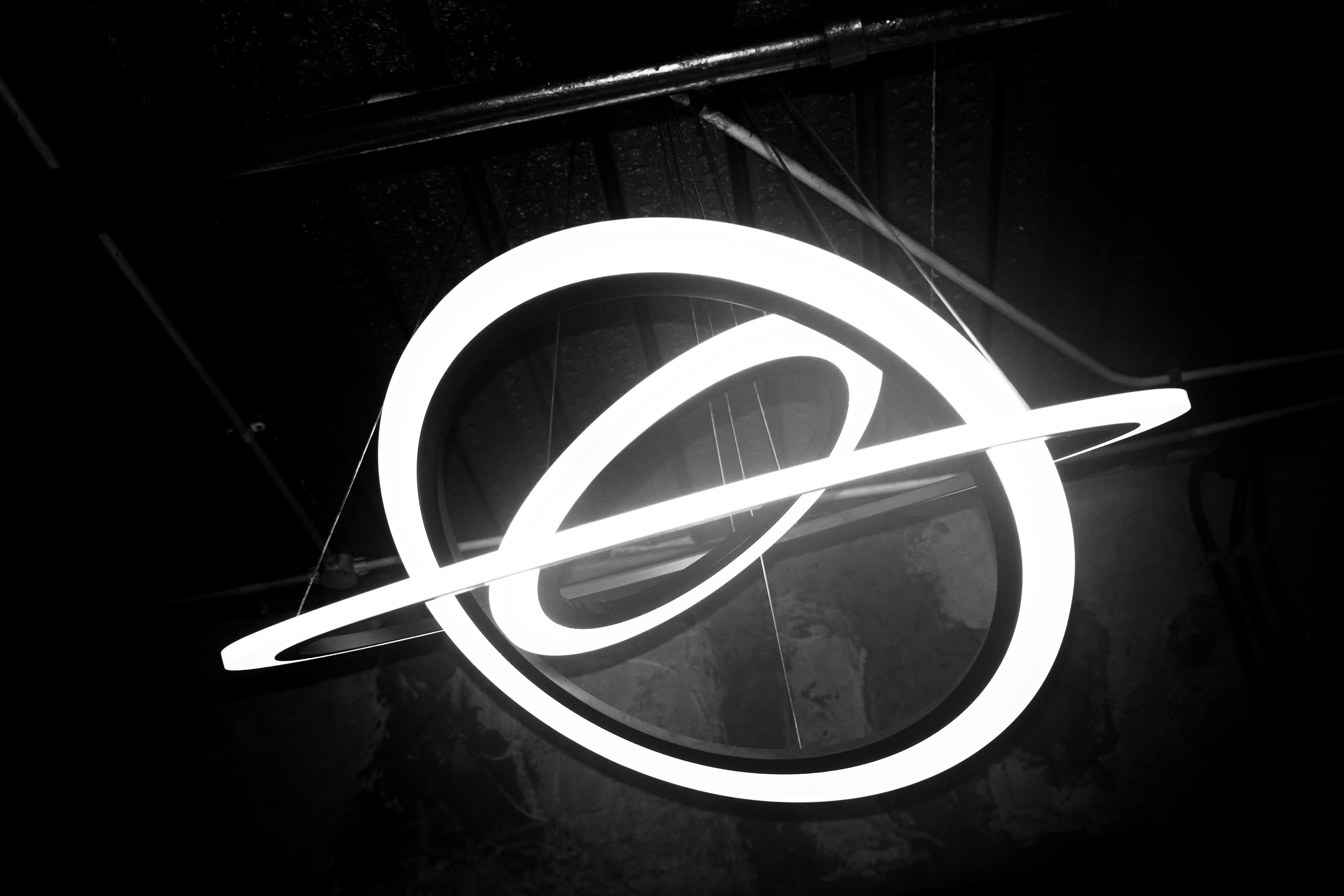 Neon Ring Constellation: A Geometric Light Sculpture in Monochrome