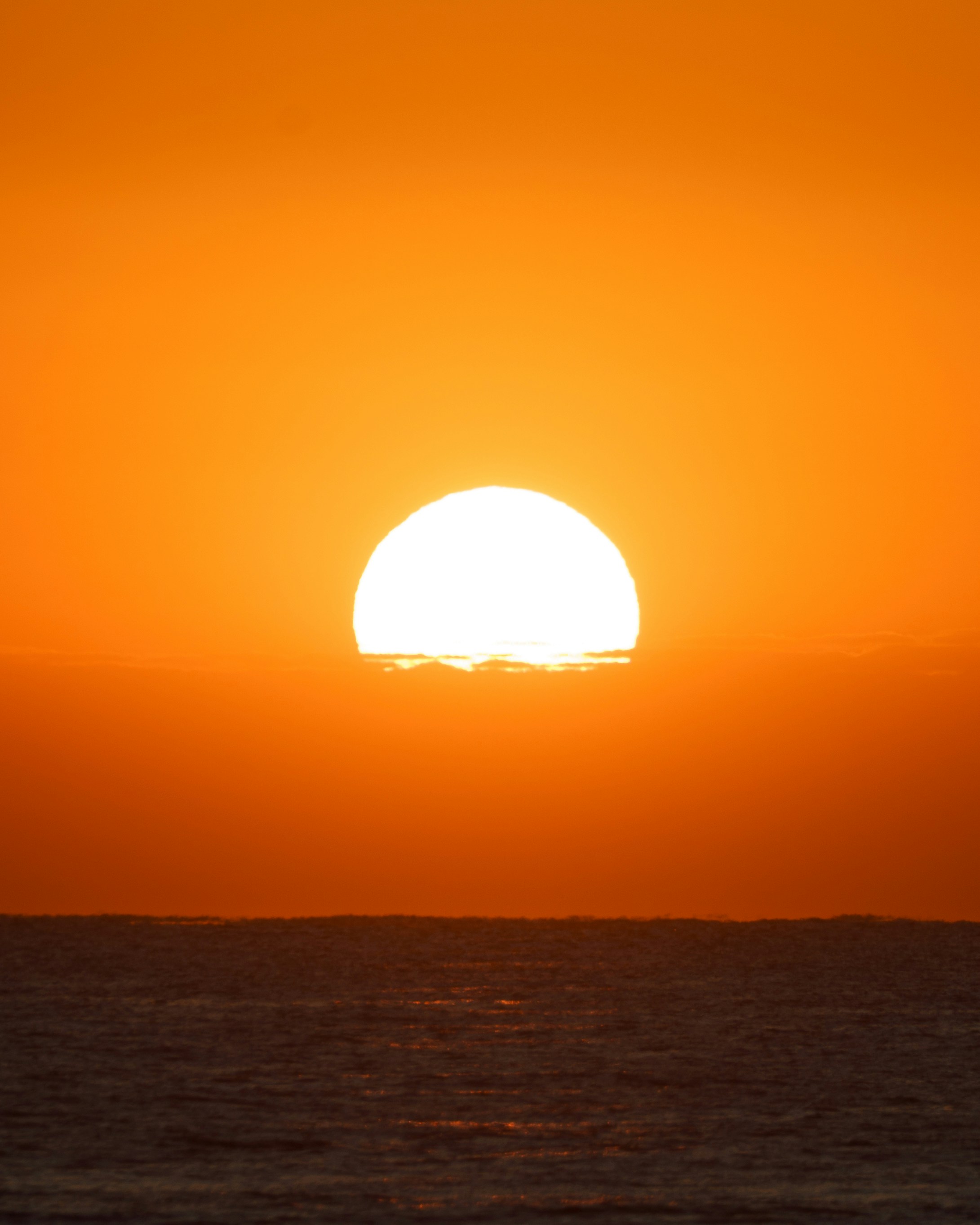 Silk Sun on a Quiet Ocean Horizon