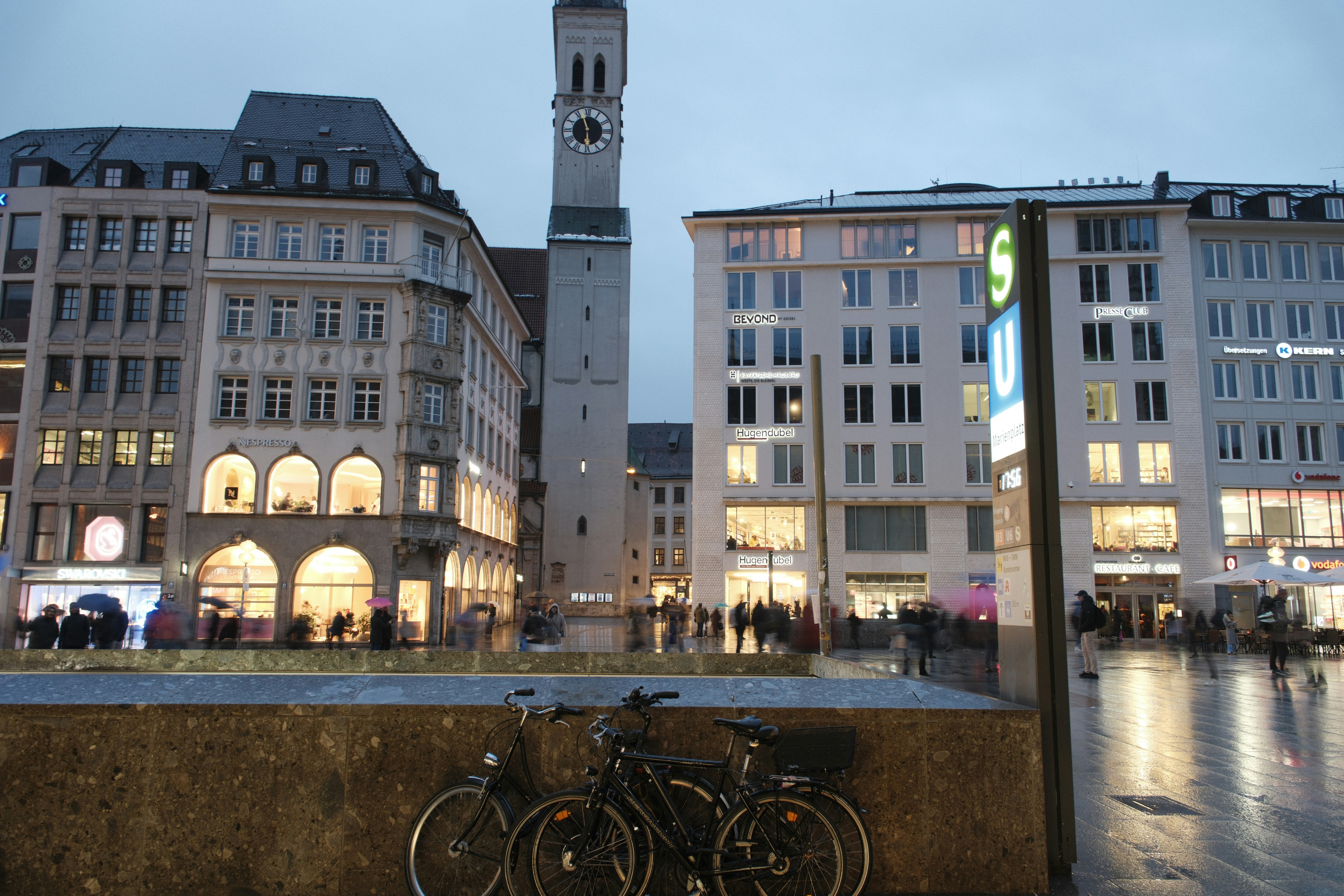 City Lights at Dusk: Bicycles by the Plazza