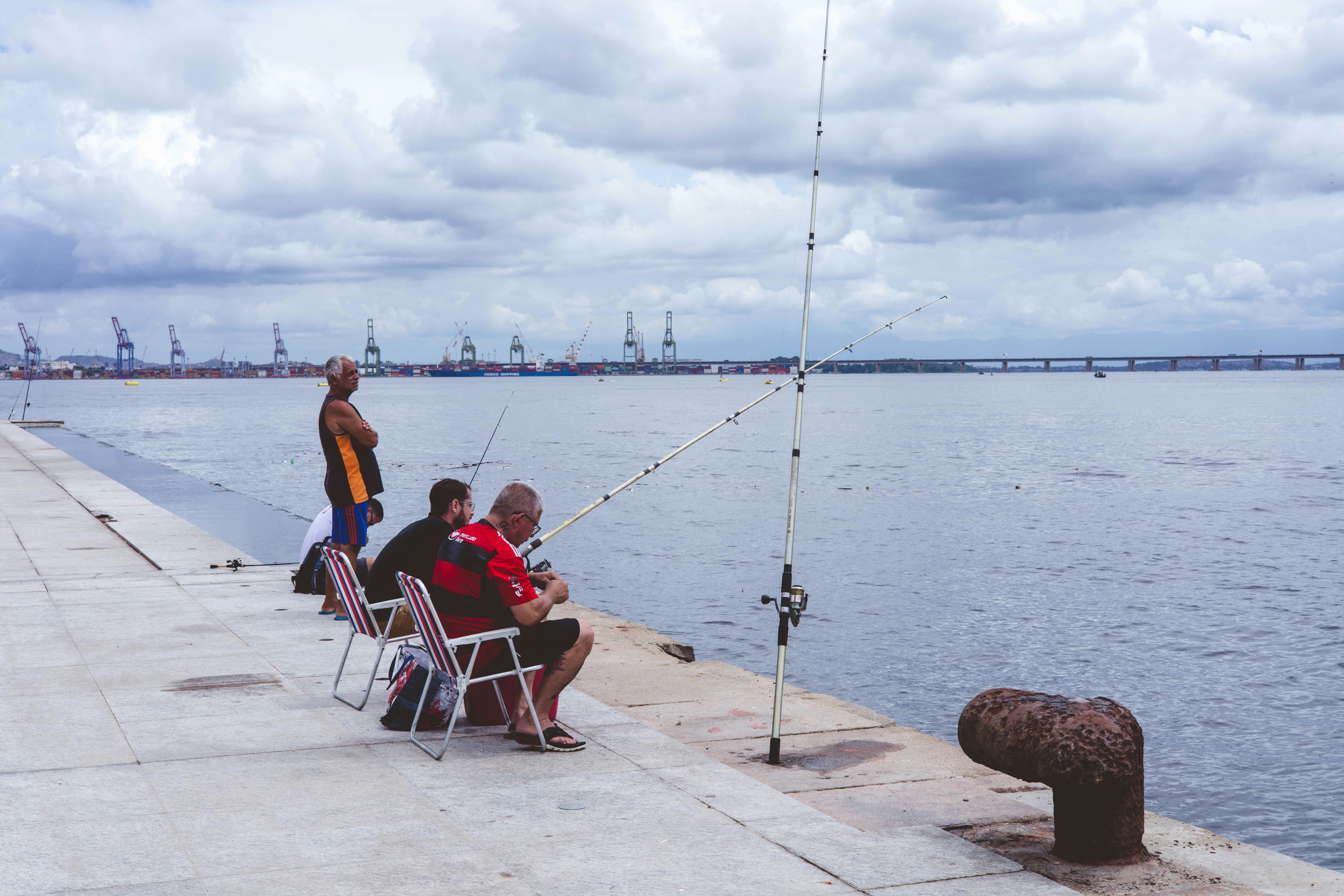 Seaside Anglers: Quiet Moment on the Pier