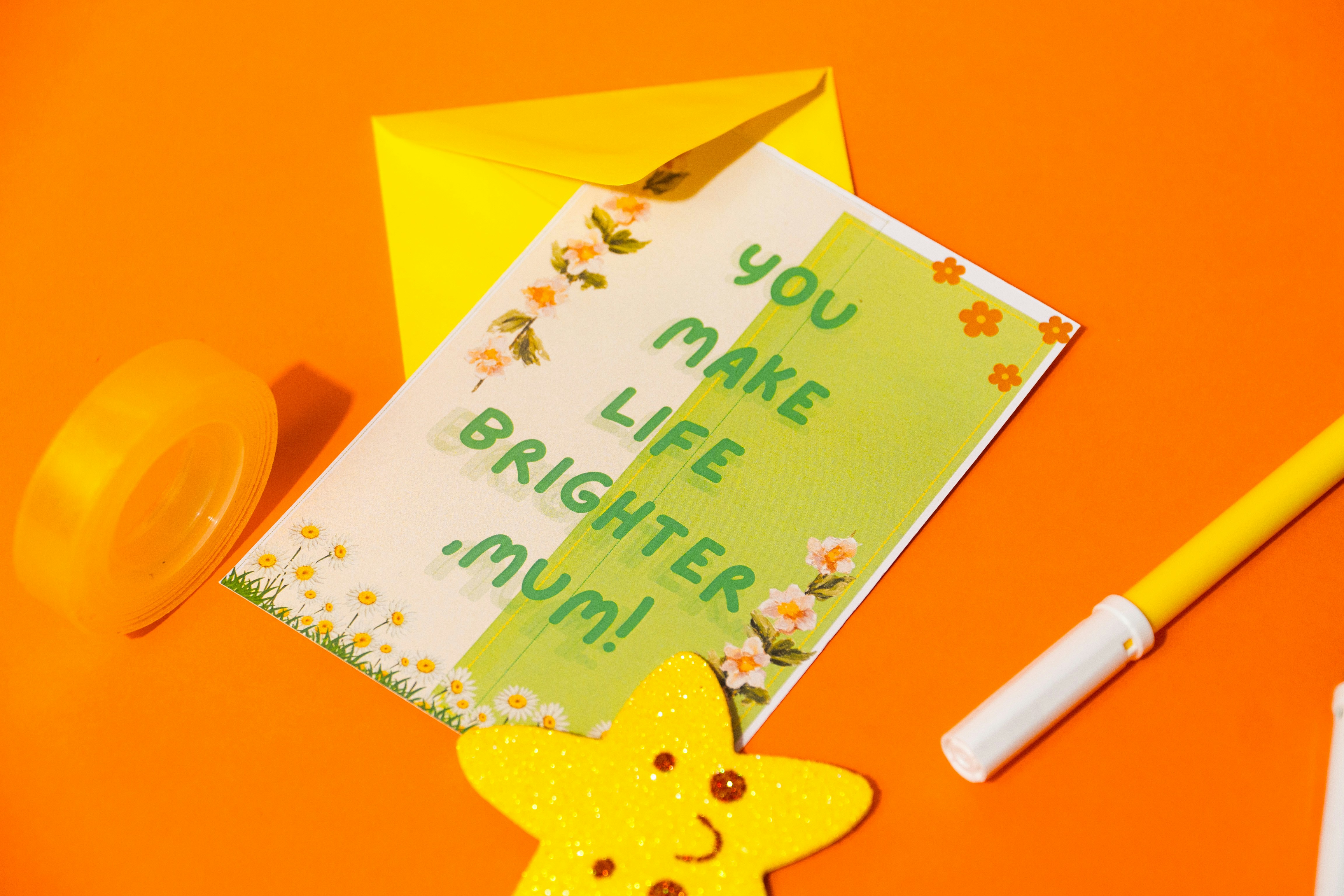  cheerful card message on bright orange backdrop with star and chalk pen