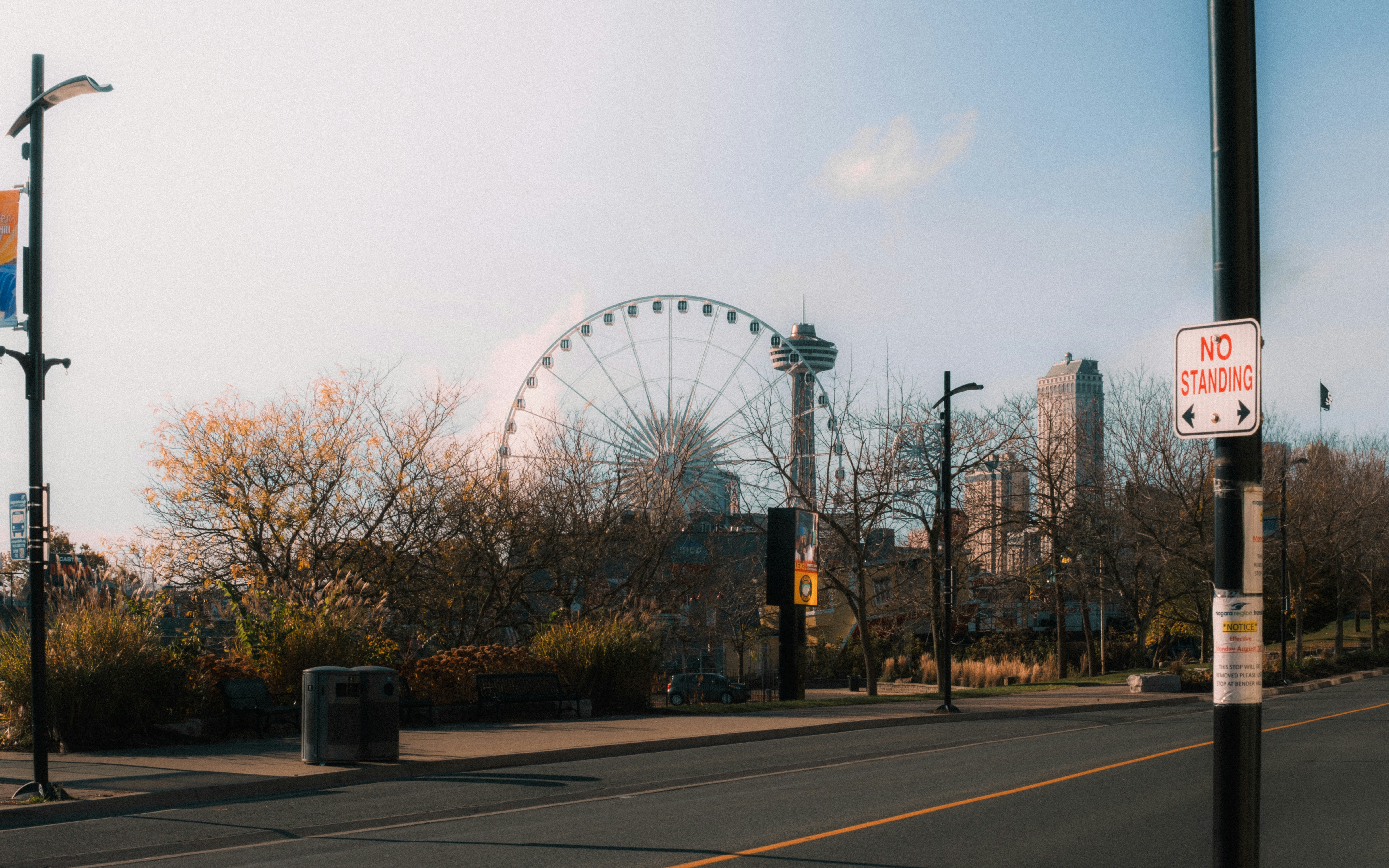 Ferris Wheel Dawn: Urban Street Quiet with Skyline silhouette
