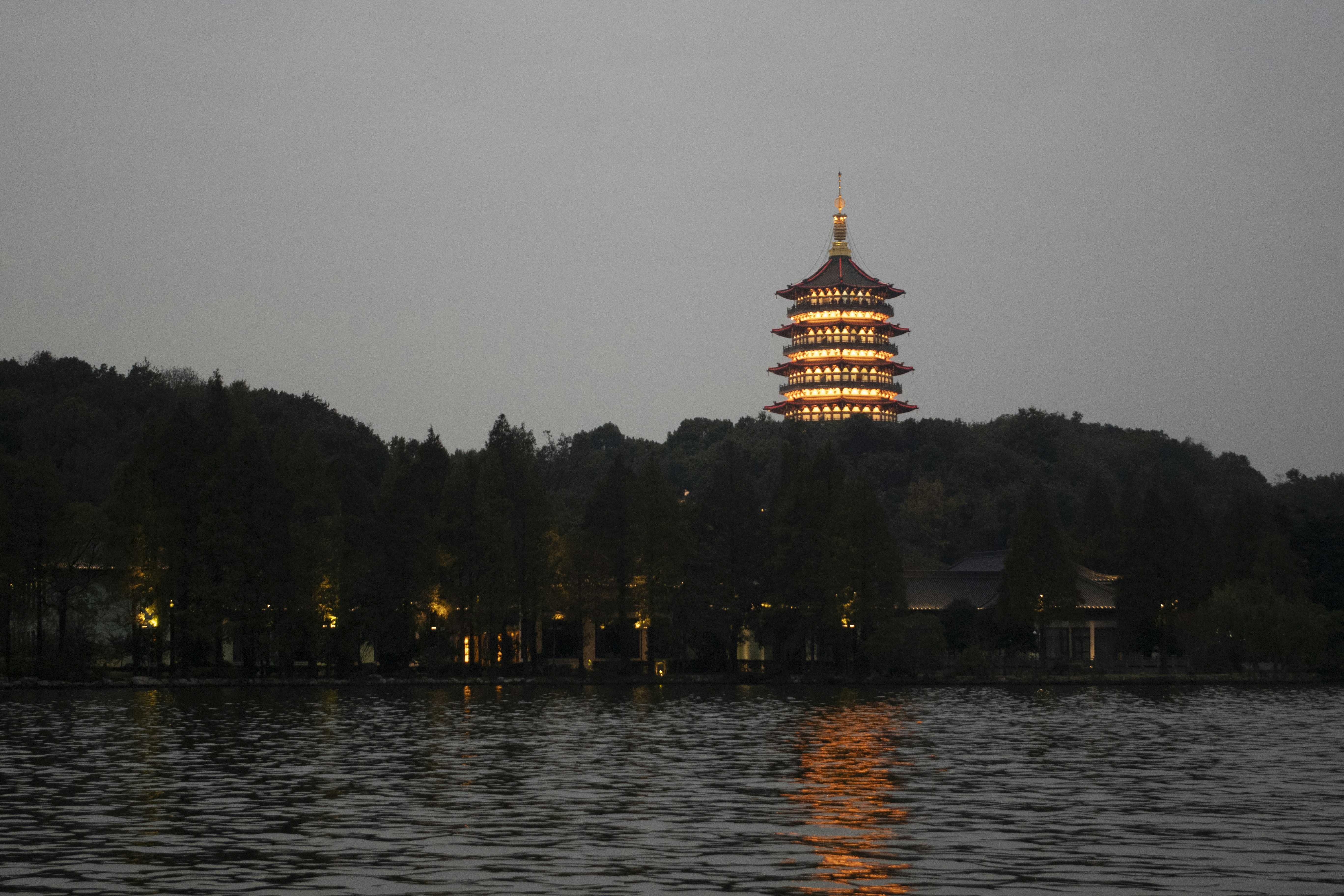 Twin-Floating Lights: A Pagoda Piercing the Dusk Over Tranquil Waters