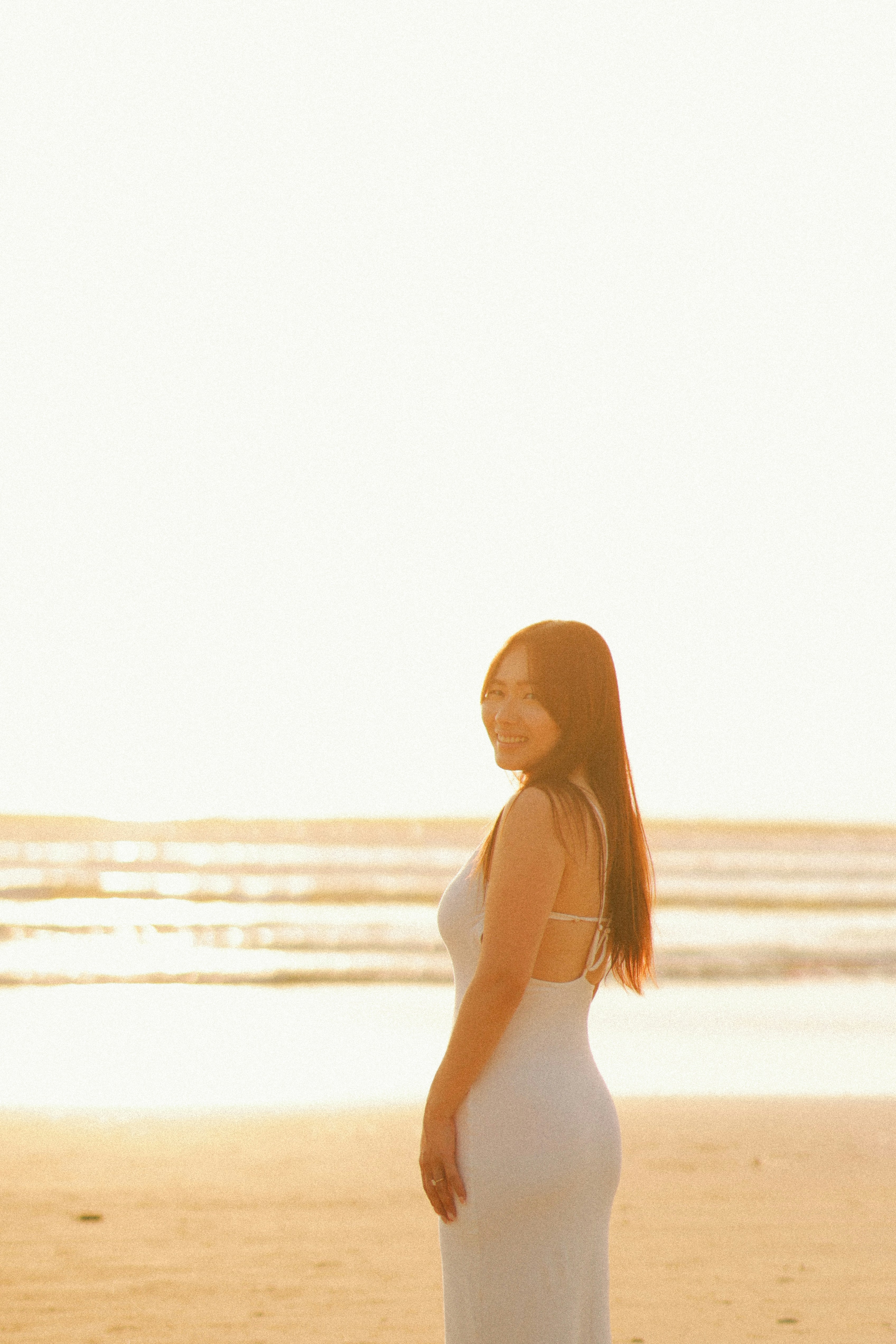 Golden Hour Silhouette: A Beachside Portrait in Soft Light