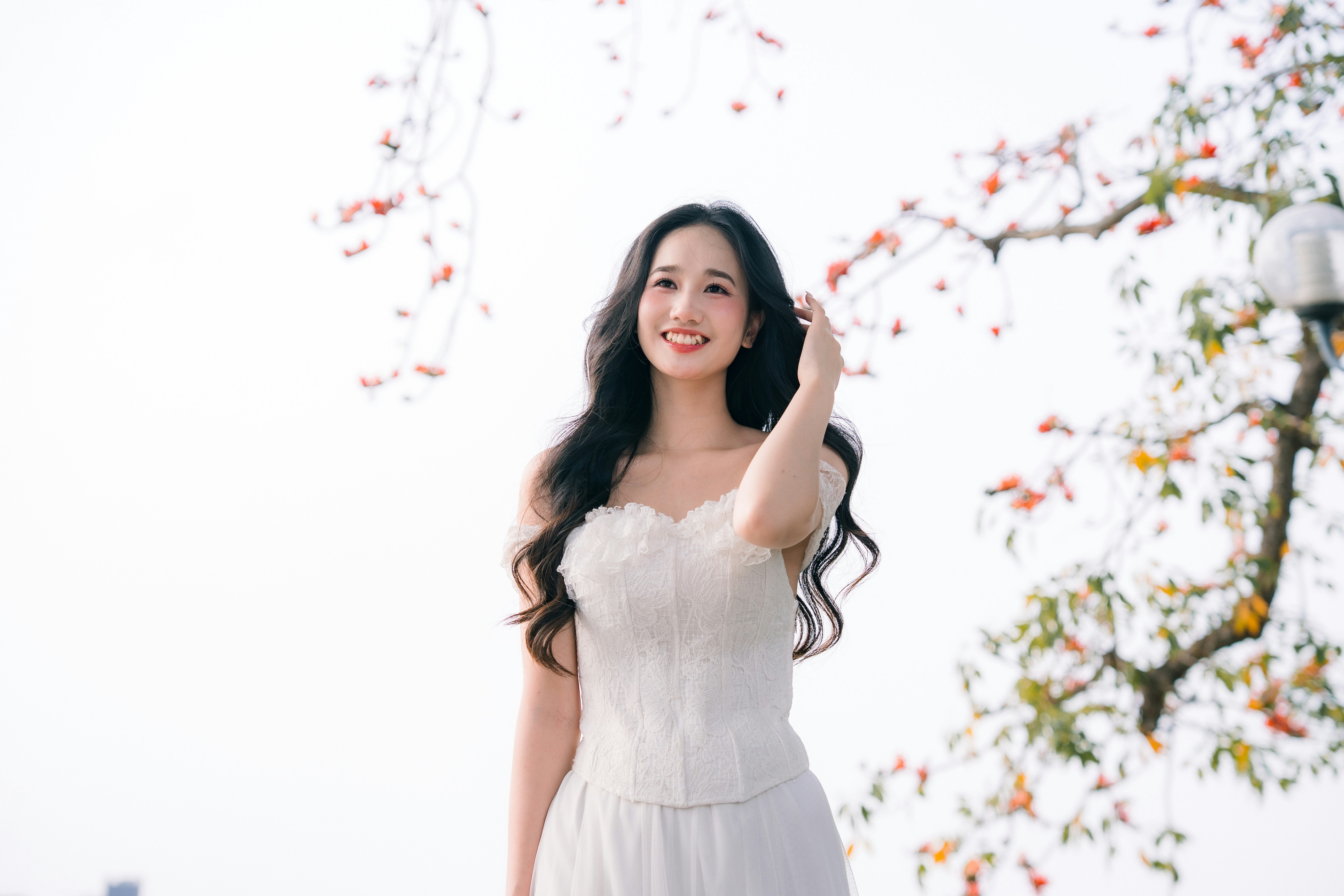 Portrait in Bloom: A White-dress Moment Under Autumnlight