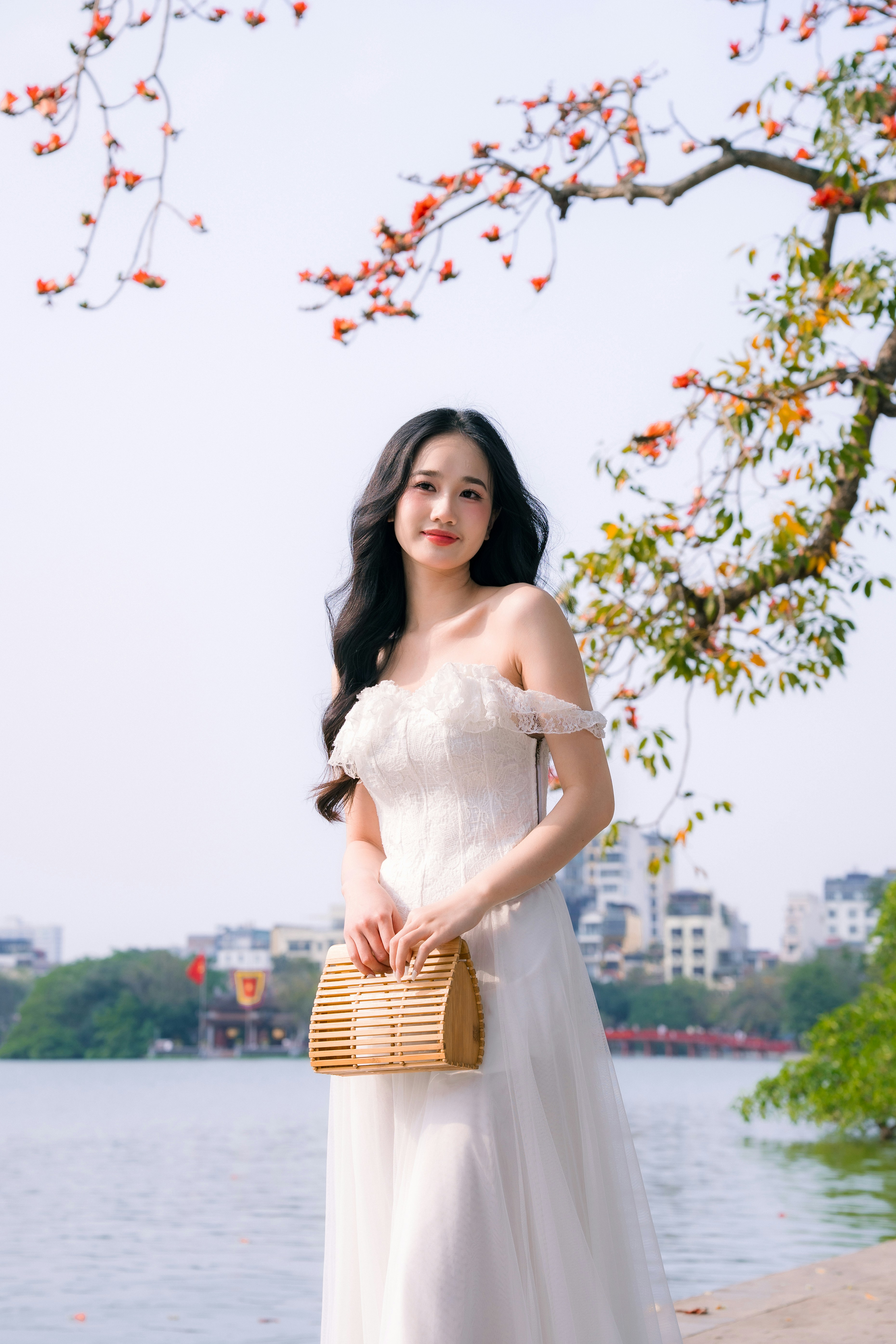 Portrait by the Waterfront: A White-Gowned Moment
