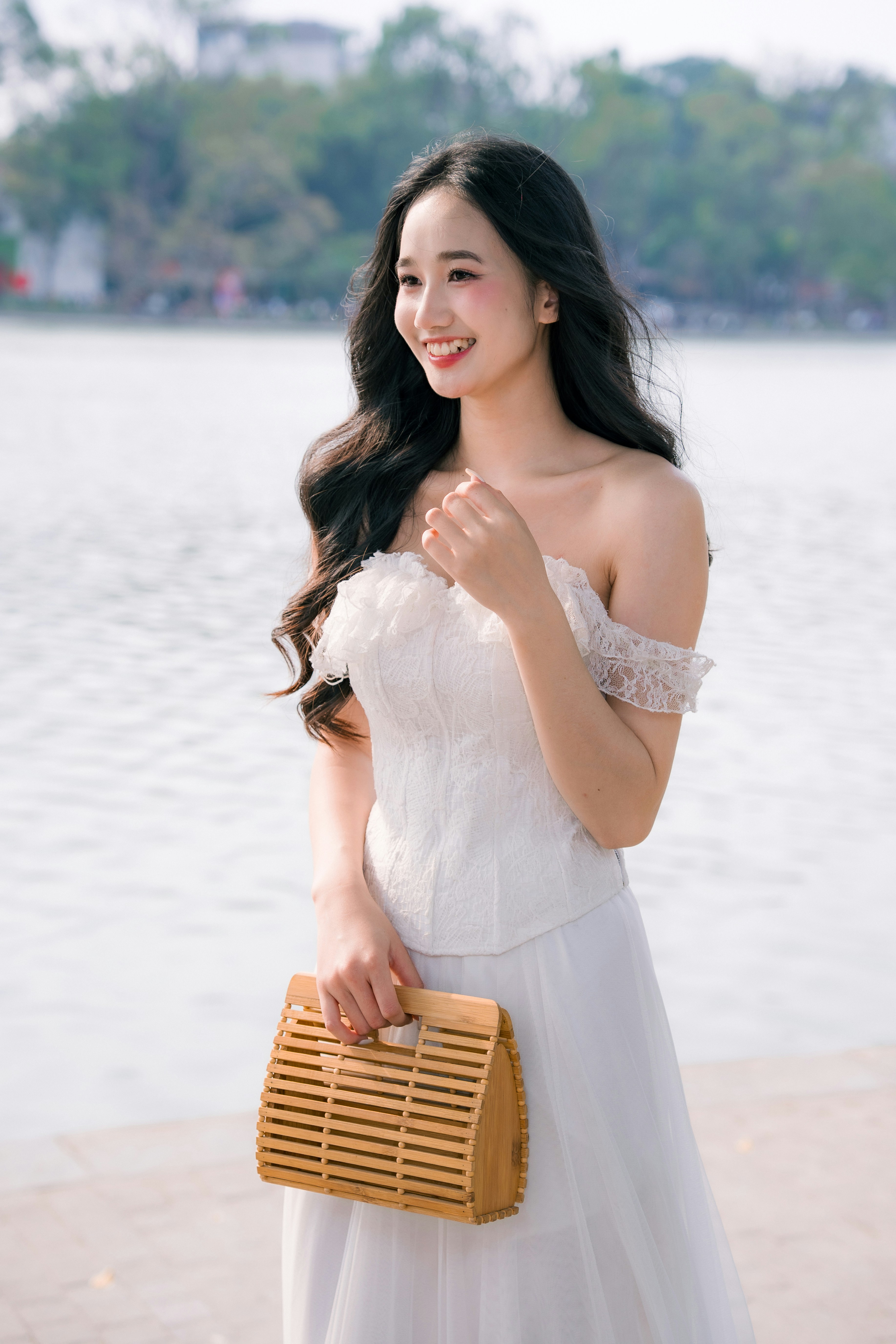 Grace by the Waterfront: A Portrait in White