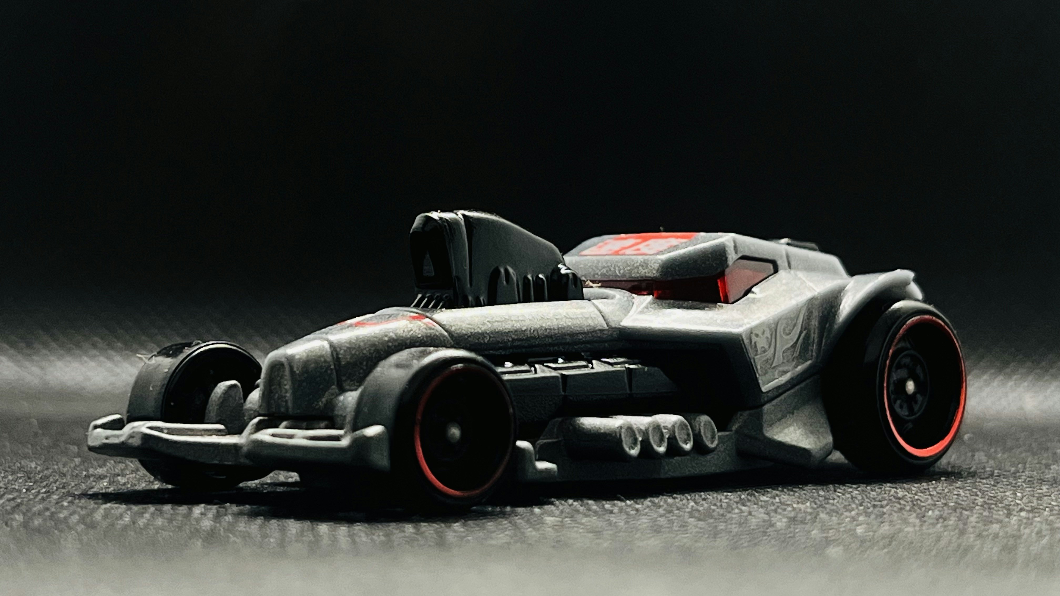Low-angle chase: a miniature armored racer on a textured surface