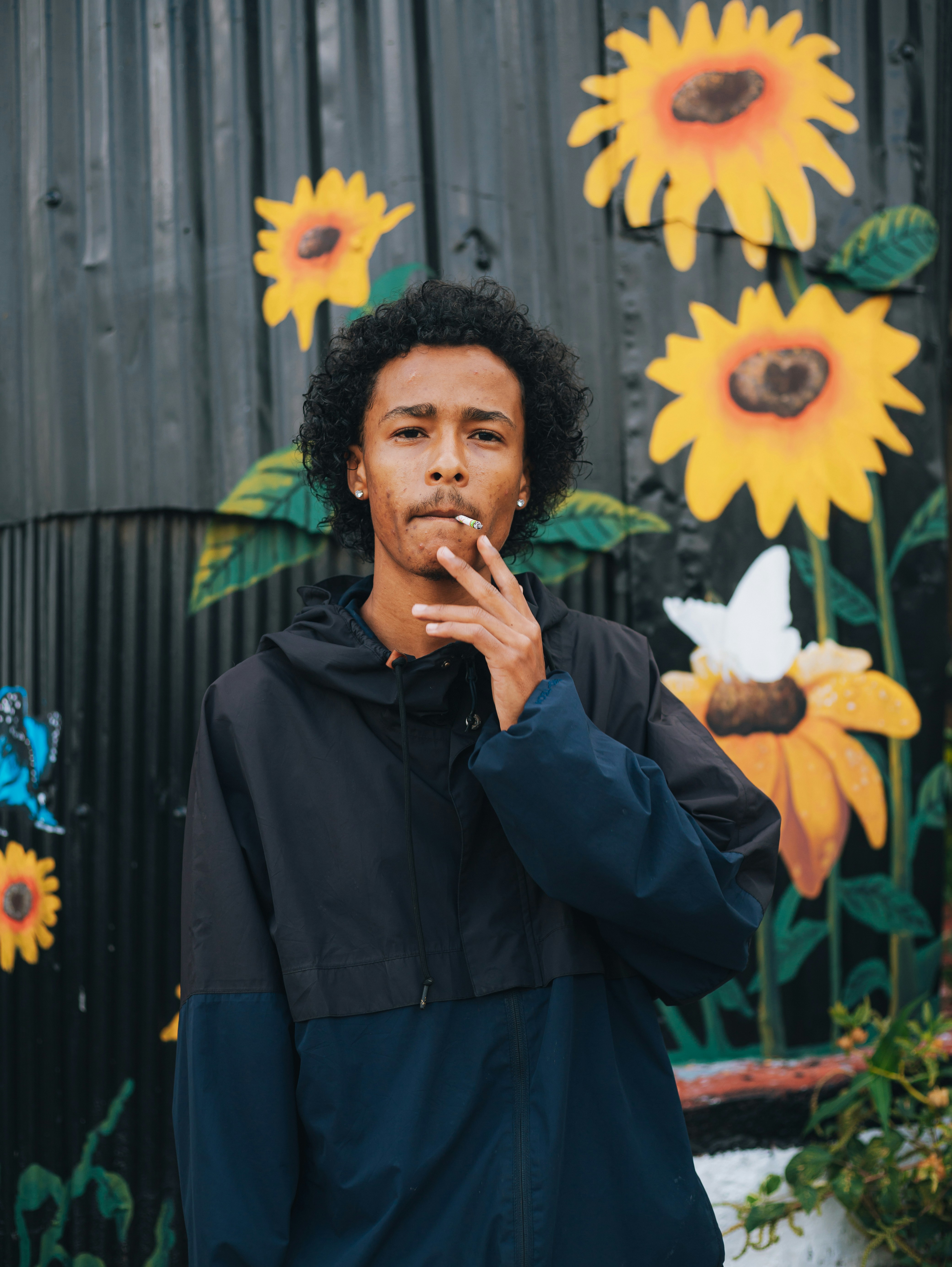 Smoke Break in a Sunflower Alley