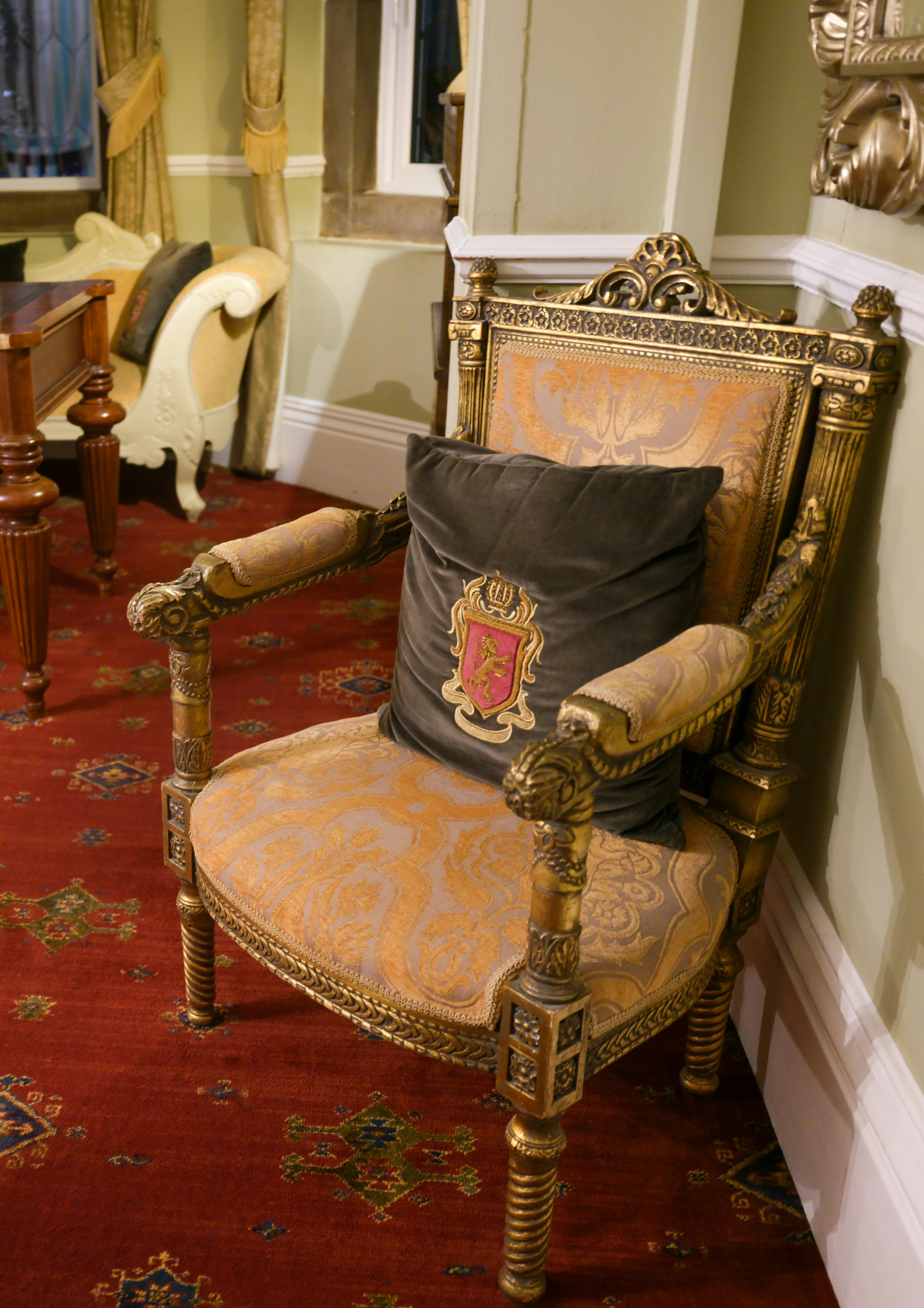 Royal Echoes: An Armchair Emblem in a Velvet Corridor