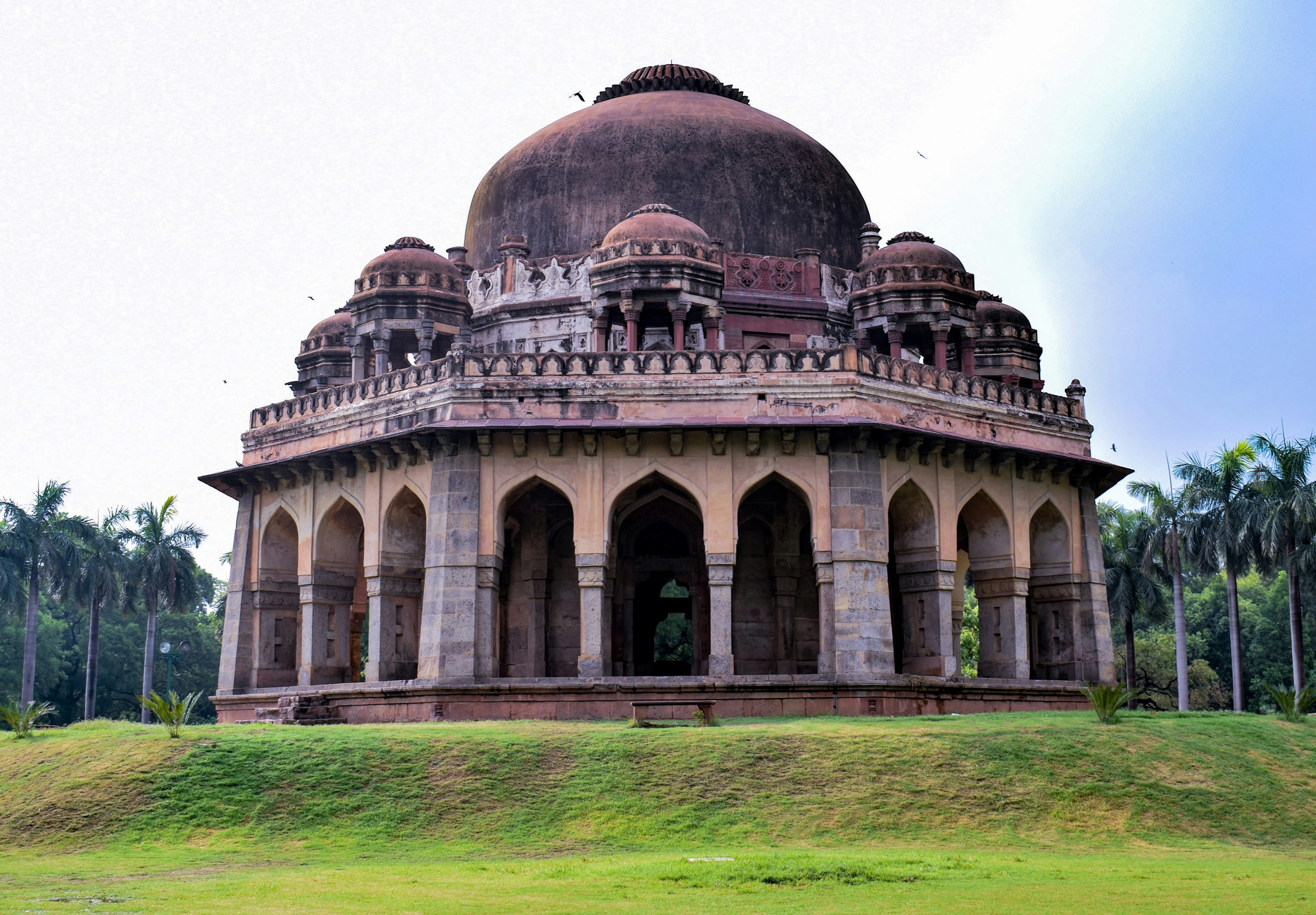Granite Dome: A Symmetrical Villa Crowned by an Emberred Dome