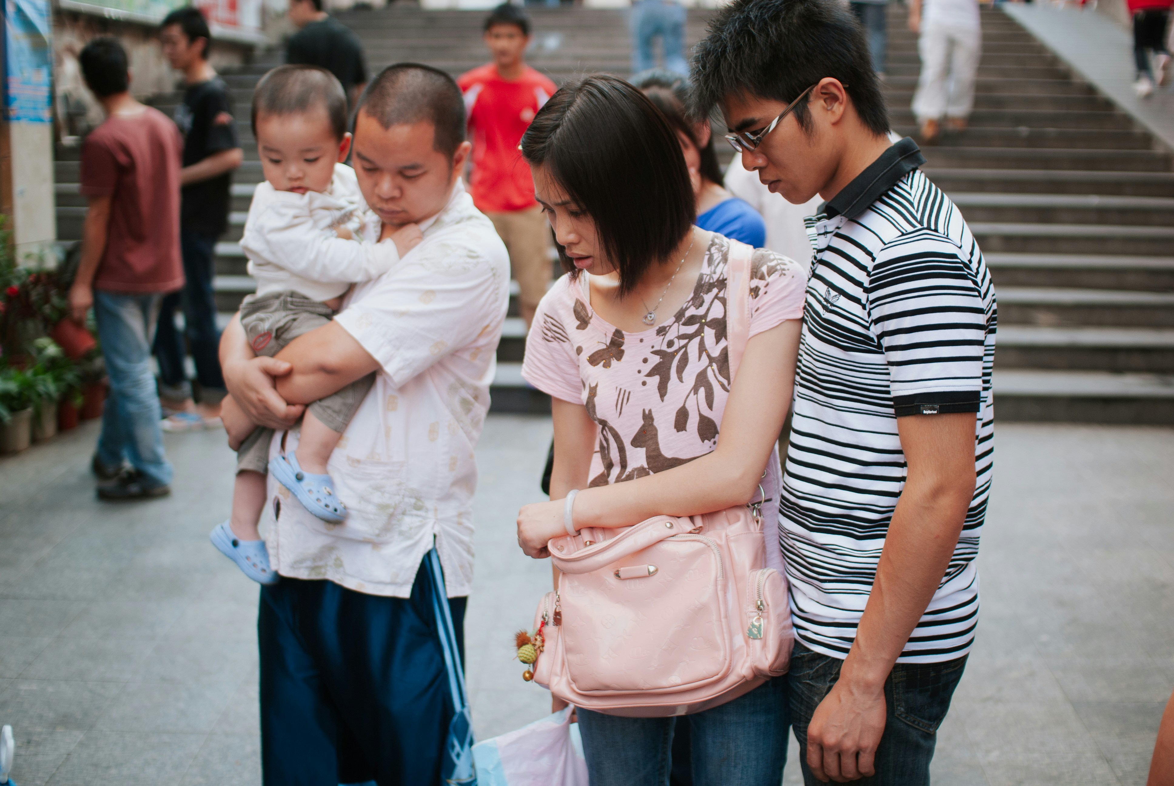 Between Moments: A Family Pause in the City Fold
