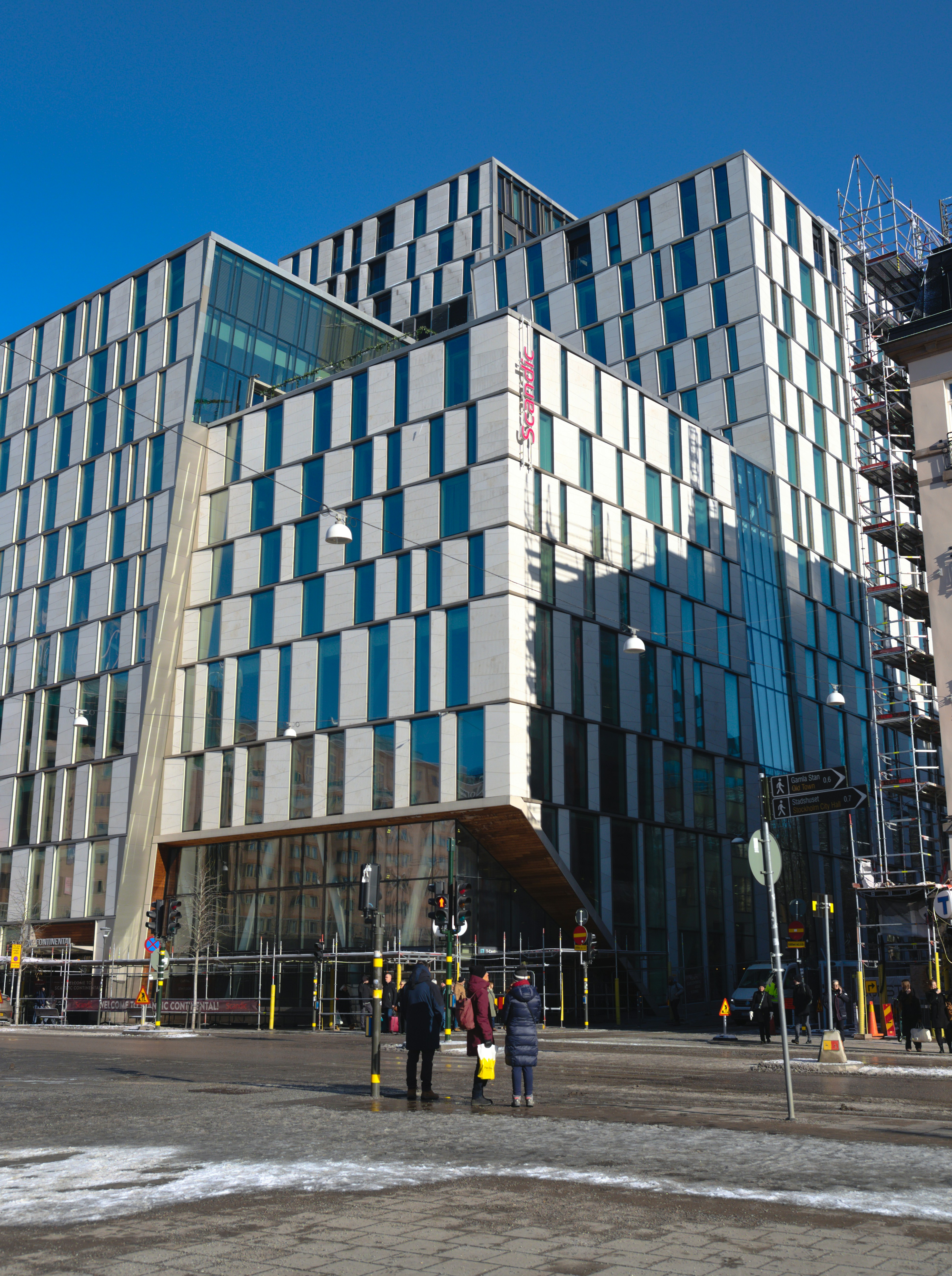 Glass Facade Echoes: A Stitch of Modern Architecture at Street Level