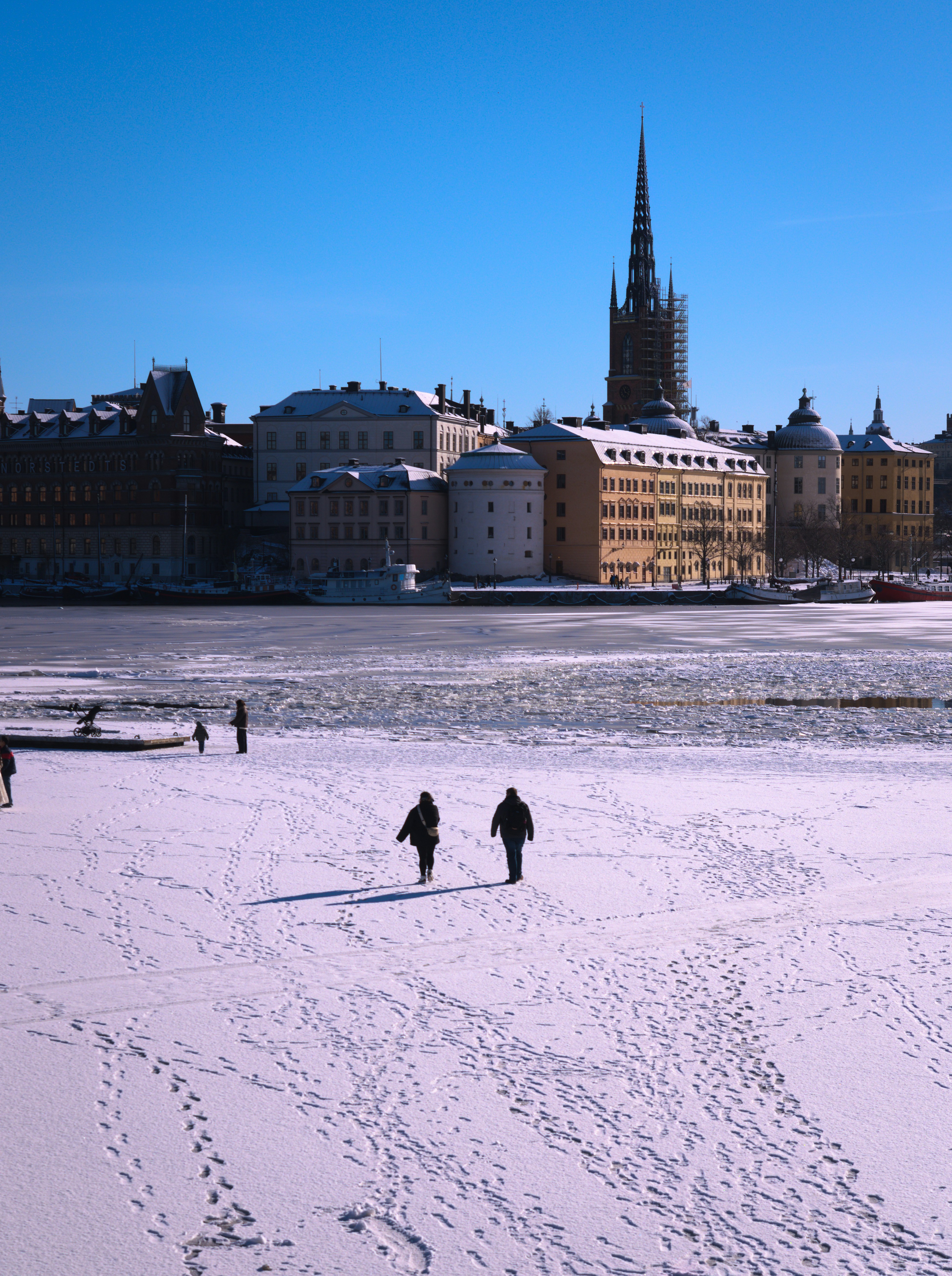 Sunny Winter Facade on the Snow-Tilted Riverfront