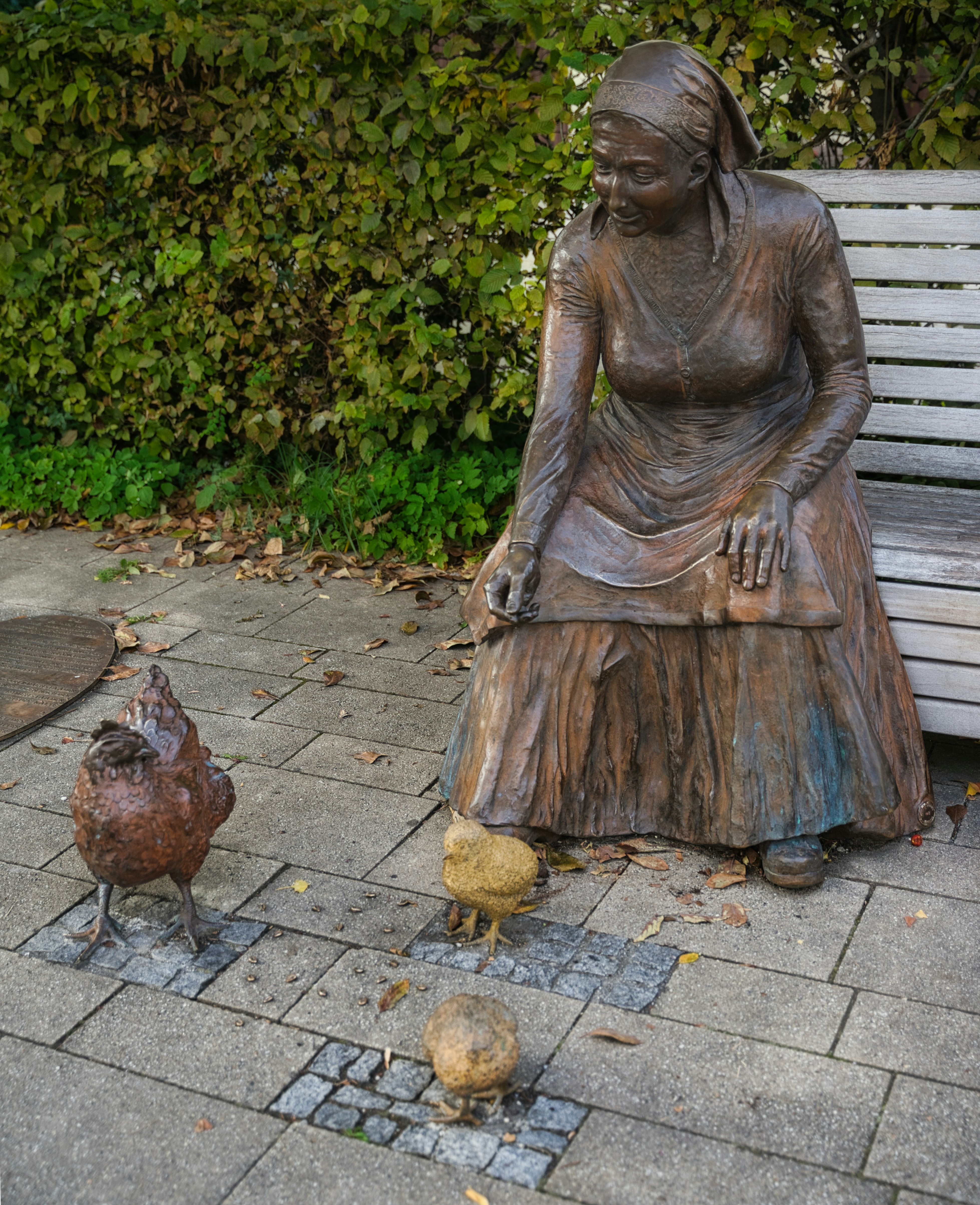 Bronze Matron with Curious Chickens