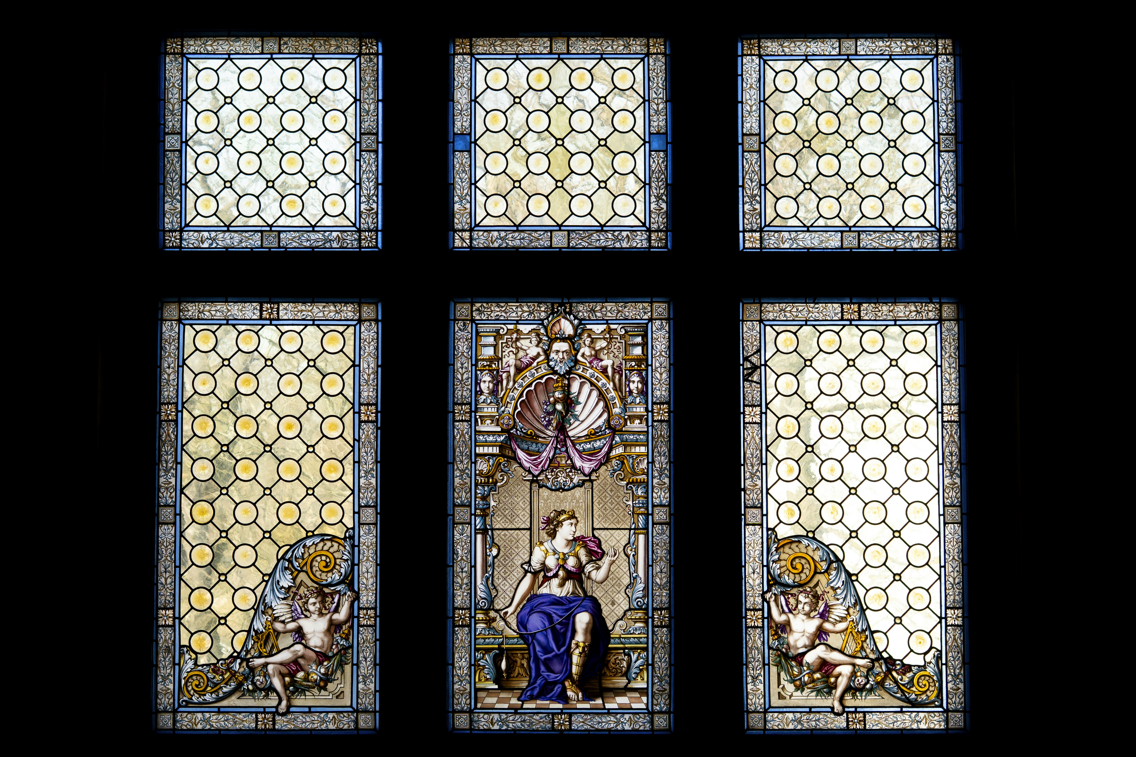 Stained Glass Triptych: Three Panels Framing a Central Regal Figure