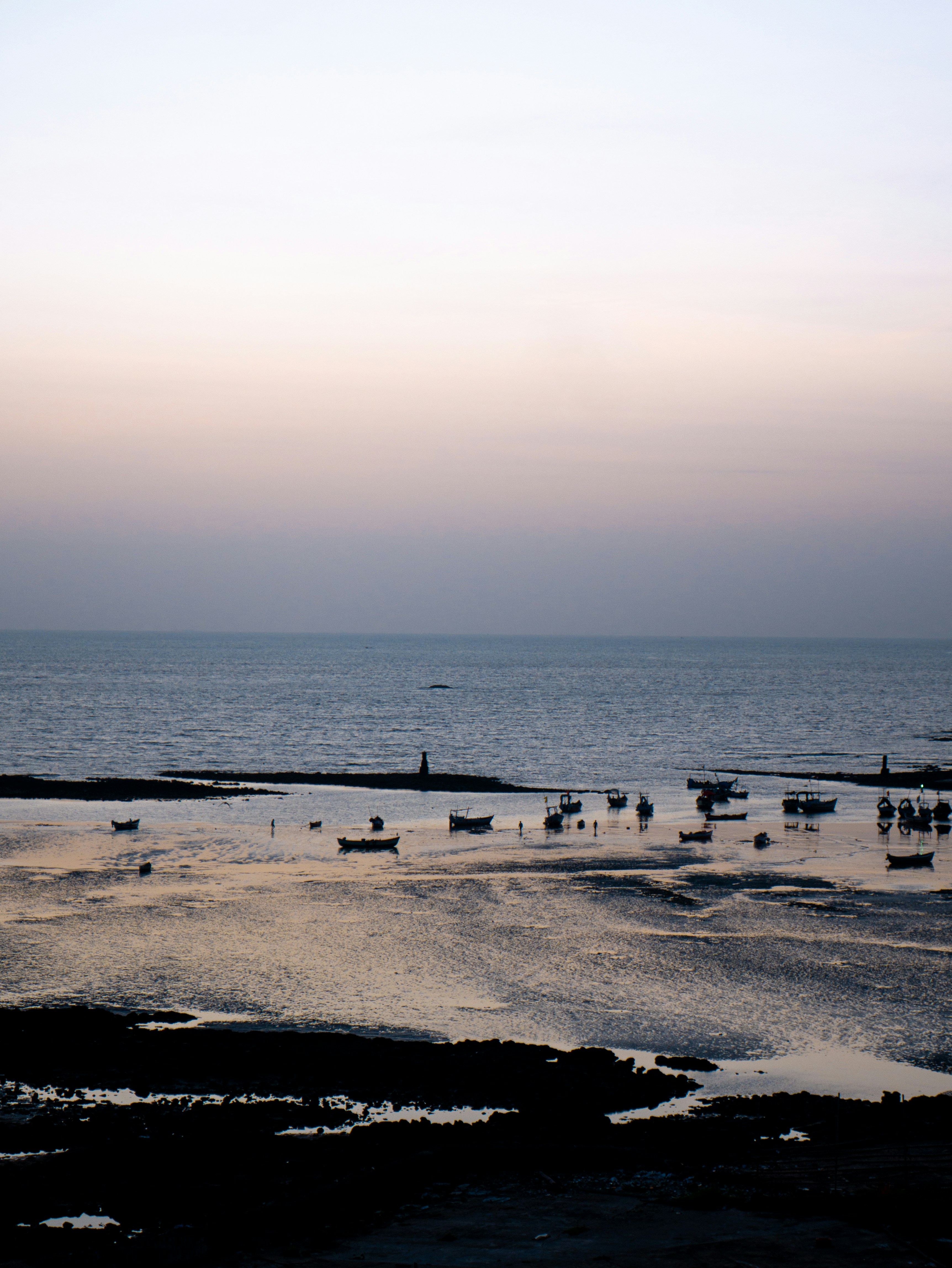 Tide Lines at Dusk: Boats resting on a Quiet Horizon