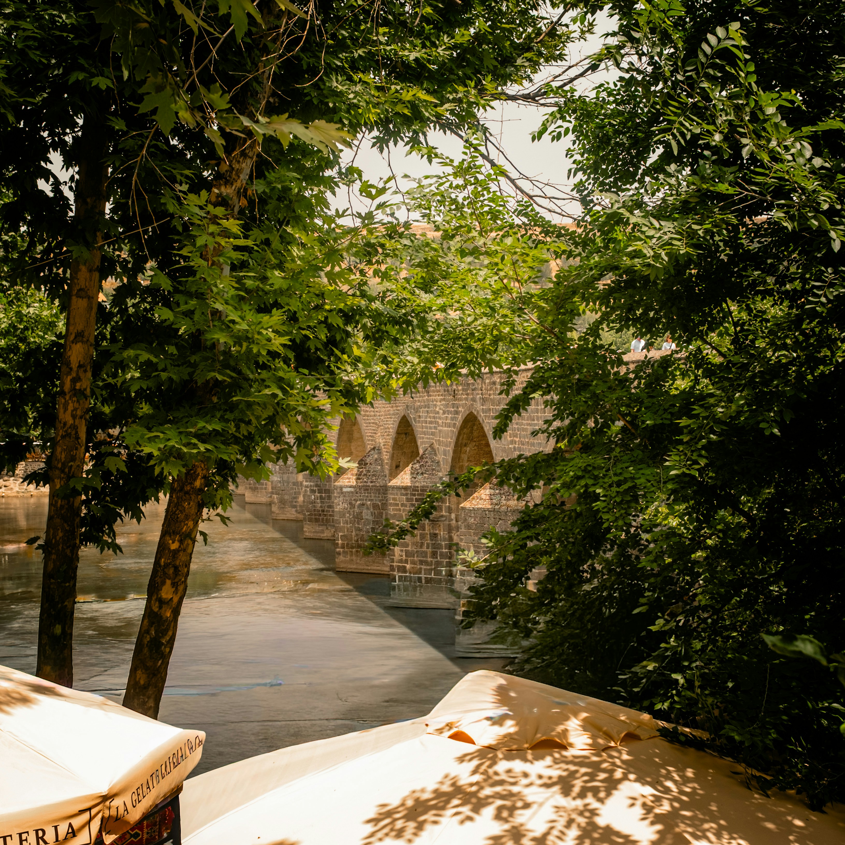 Stone Bridge View Through Framed Greenery
