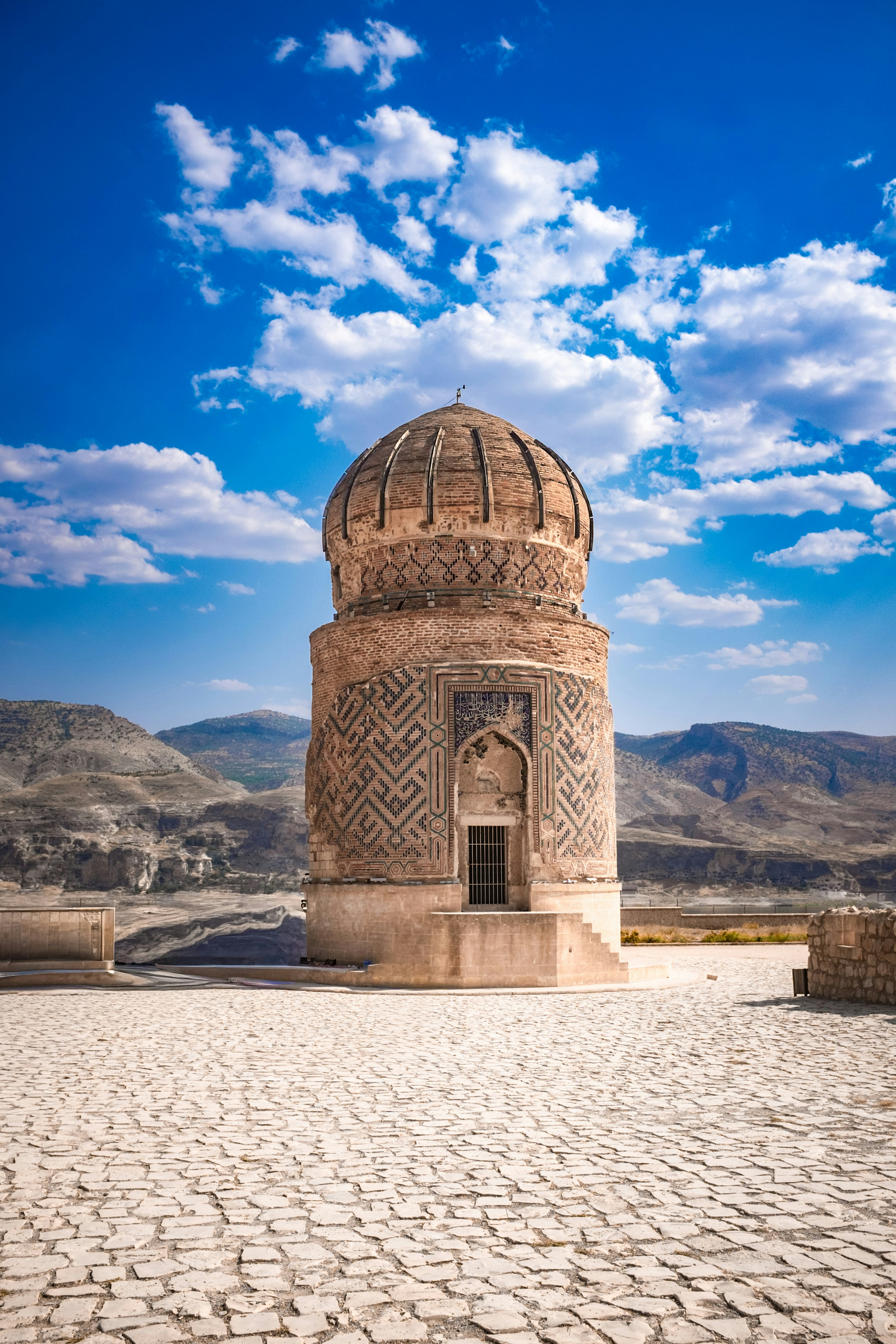 Ancient Dome Watchtower Rising from Sunlit Paved Plaza