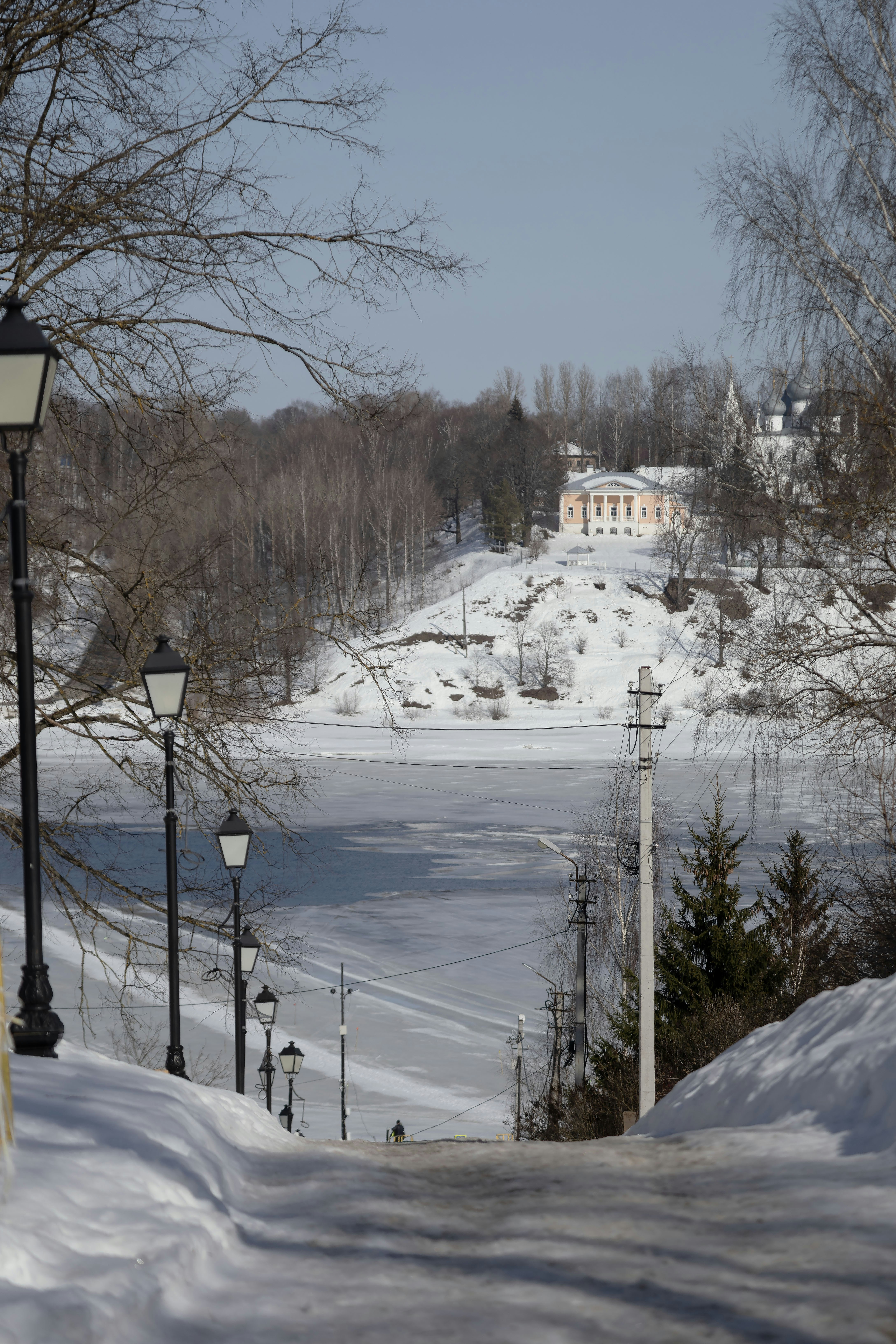 Snow-Blanketed Avenue Leading to a Distant Villa