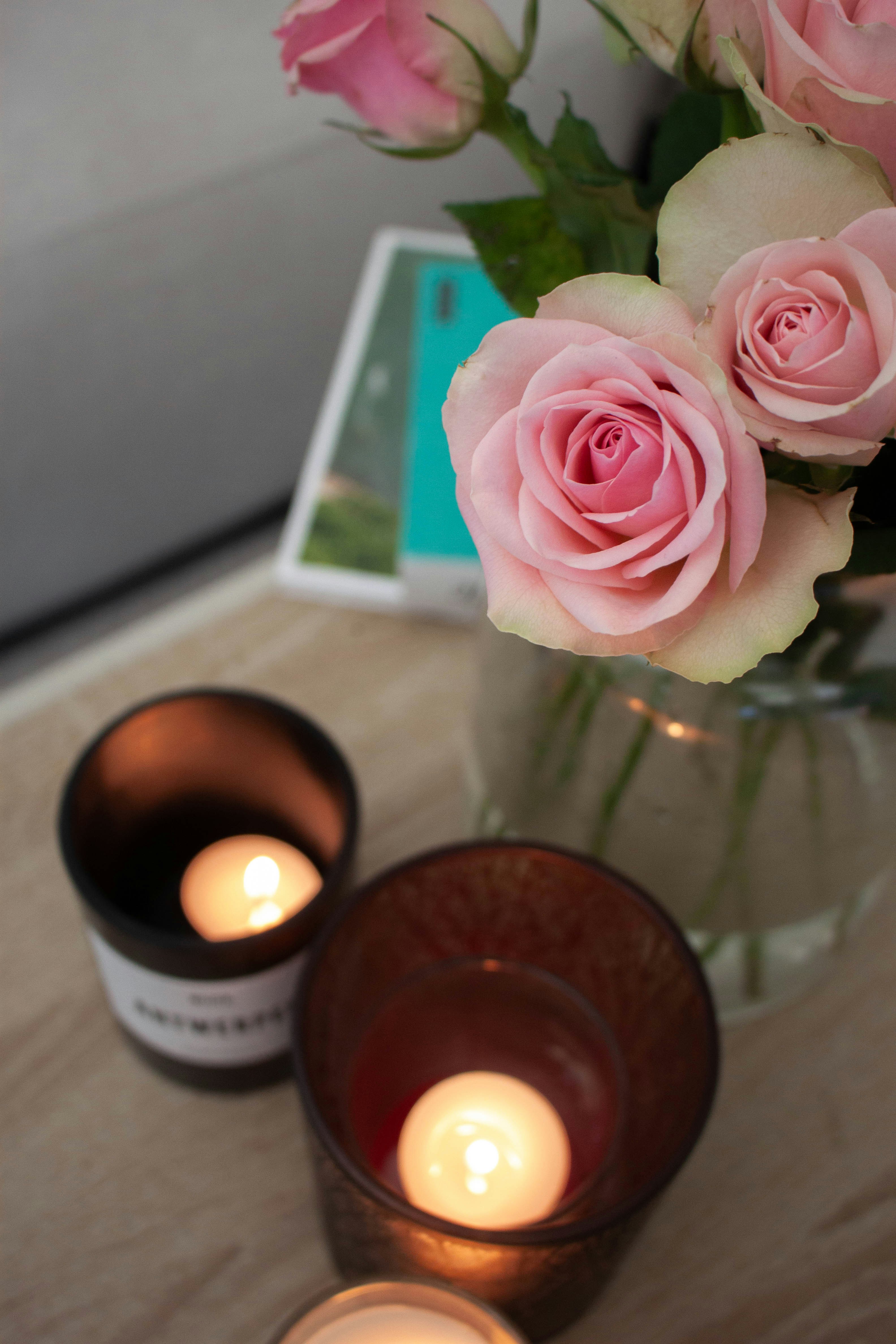 Blush Roses and Ambient Candles on a Quiet Table