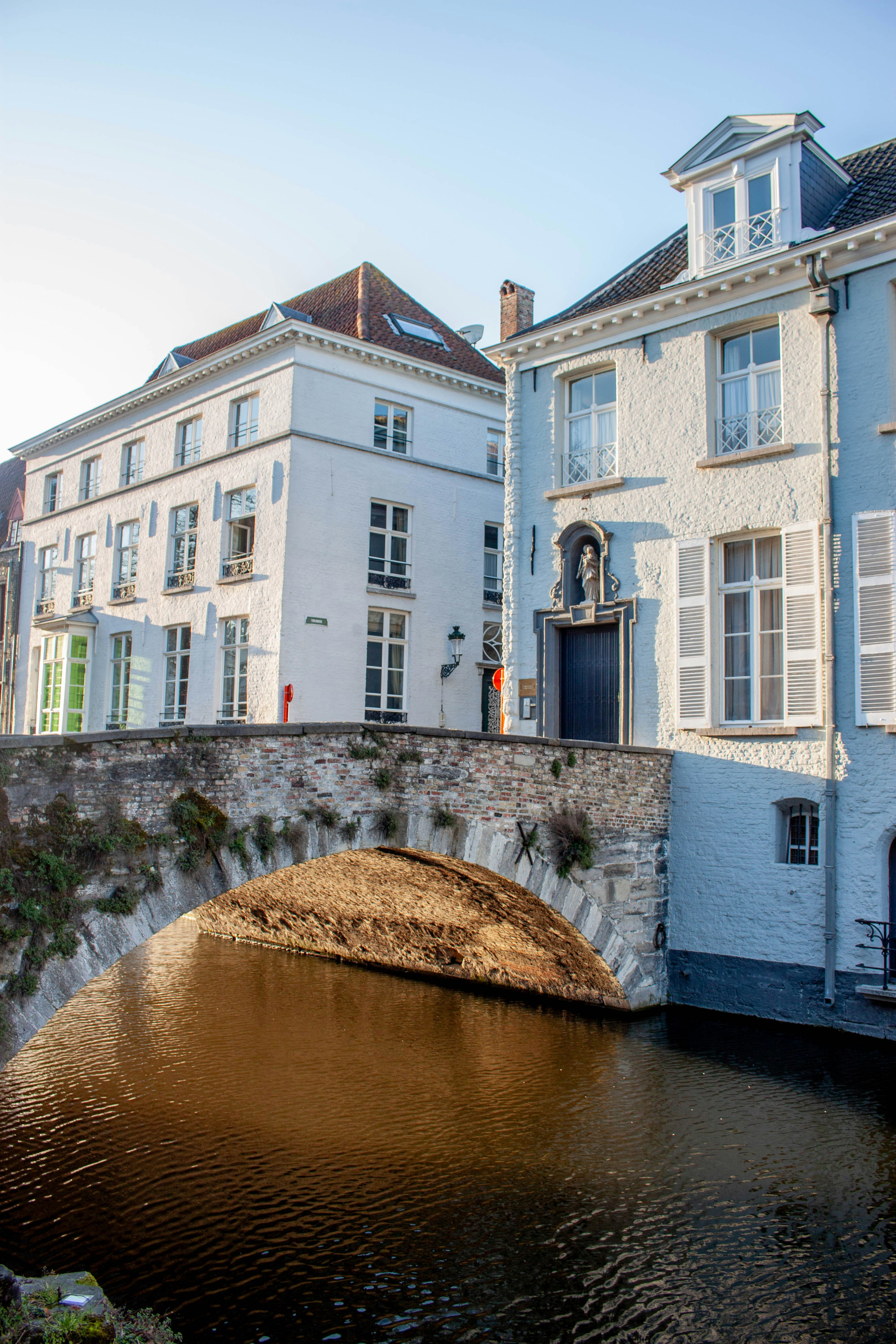 Bridge and Facades: A Quiet Riverfront in Soft Evening Light