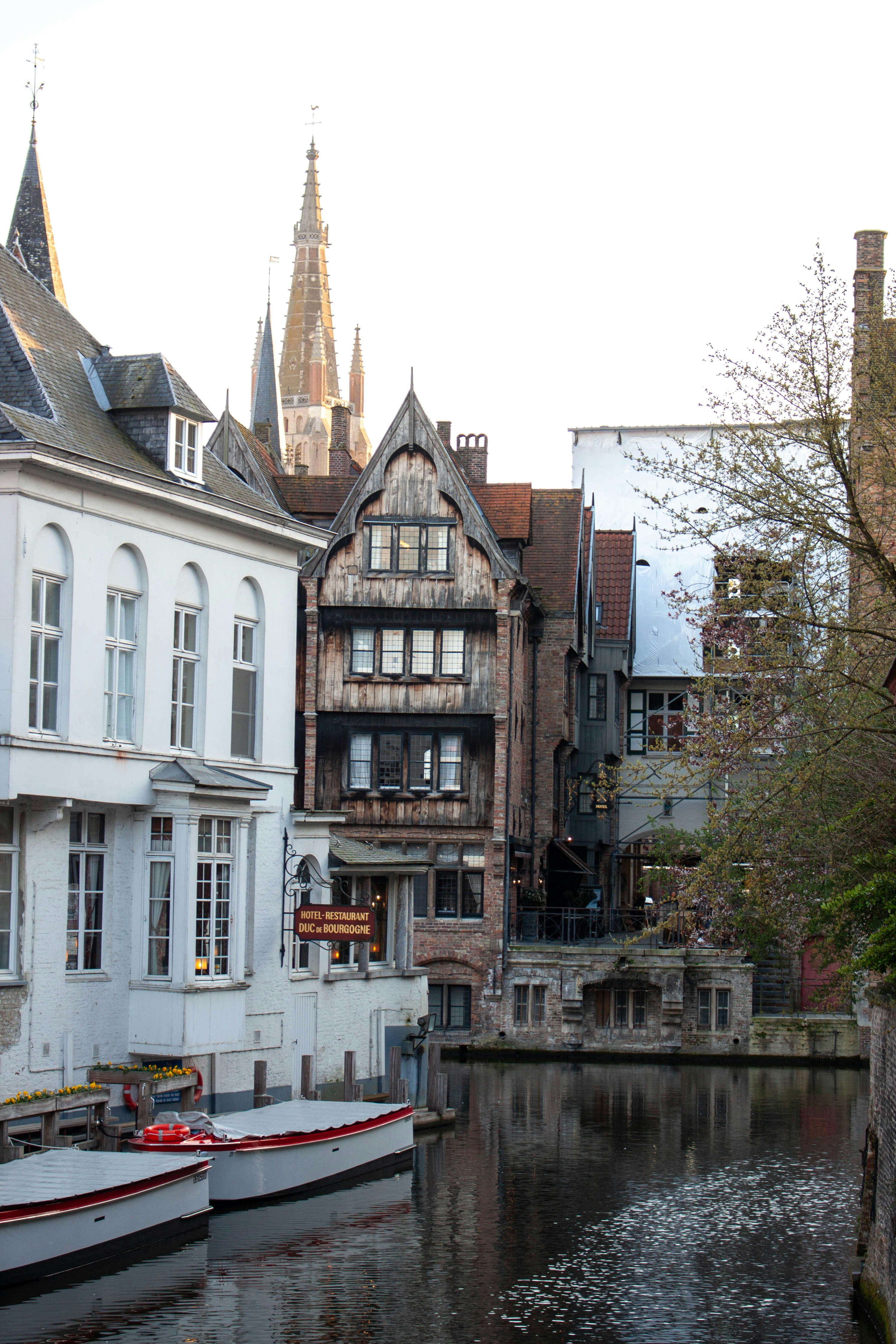 Canal-side Timbered Facade and White-Colonnaded House at Dusk