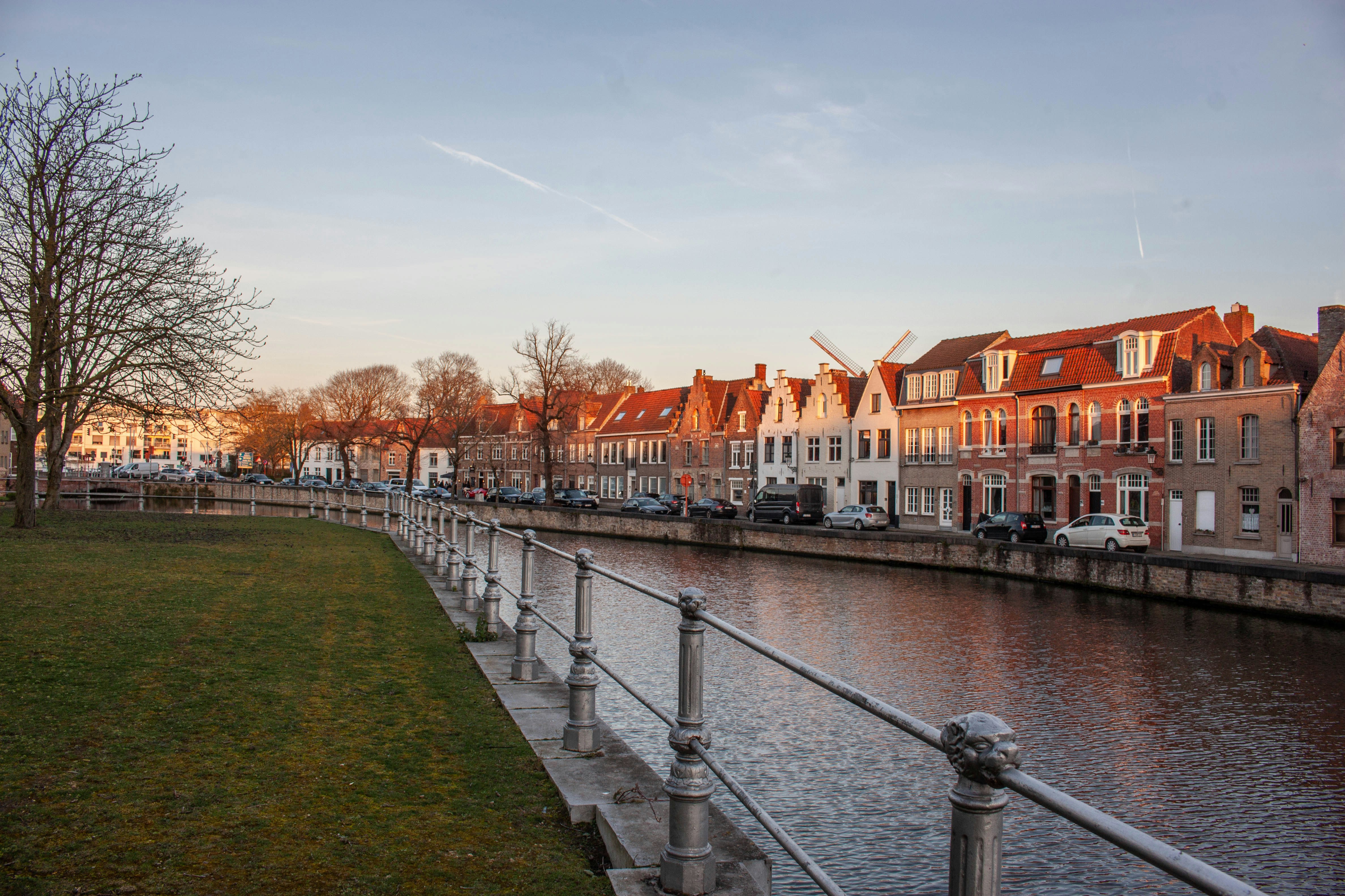 Sunlit Riverside Row: Quiet Canal and Townfront Charm
