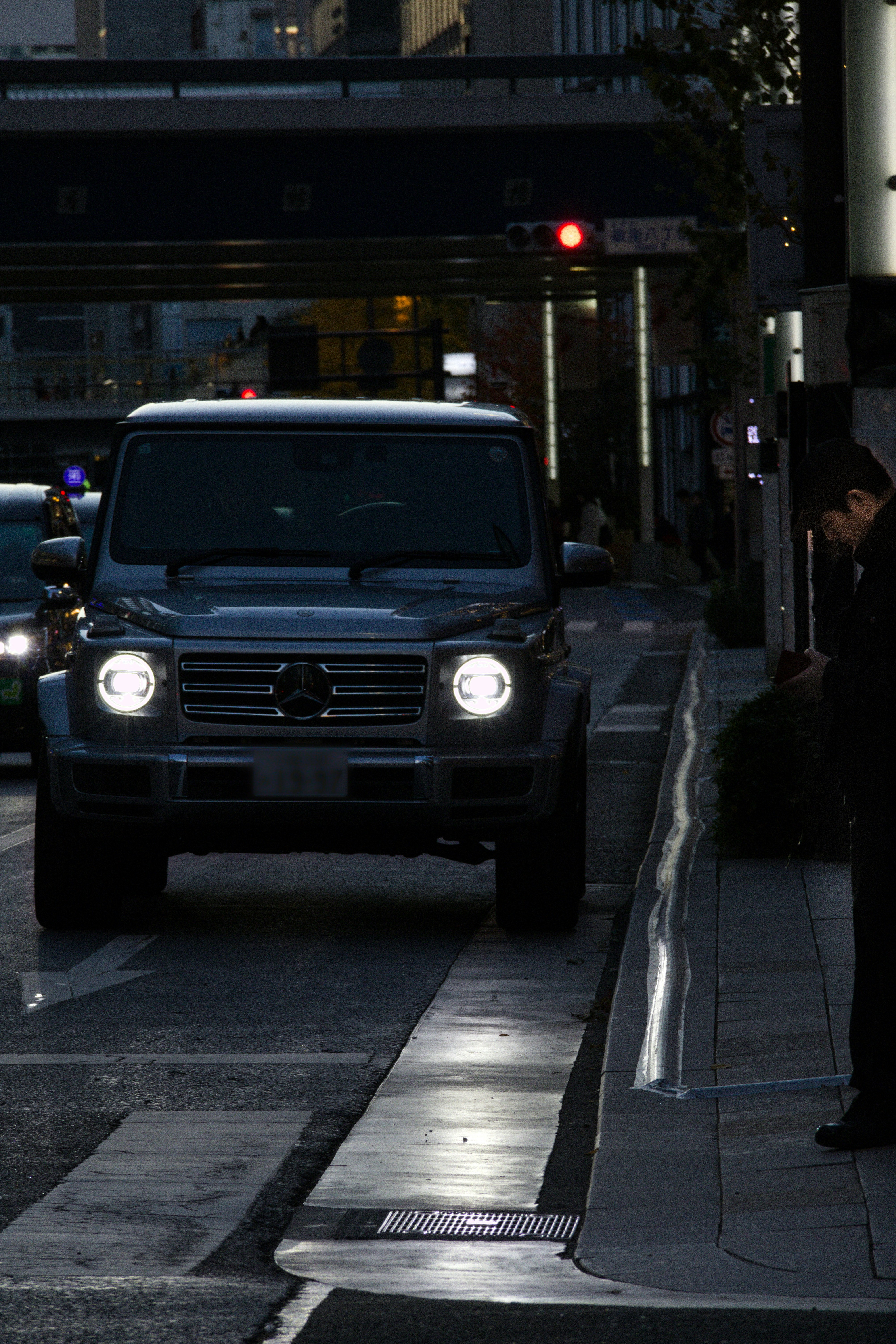 Silver Mercedes SUV in a Quiet City Street at Dusk