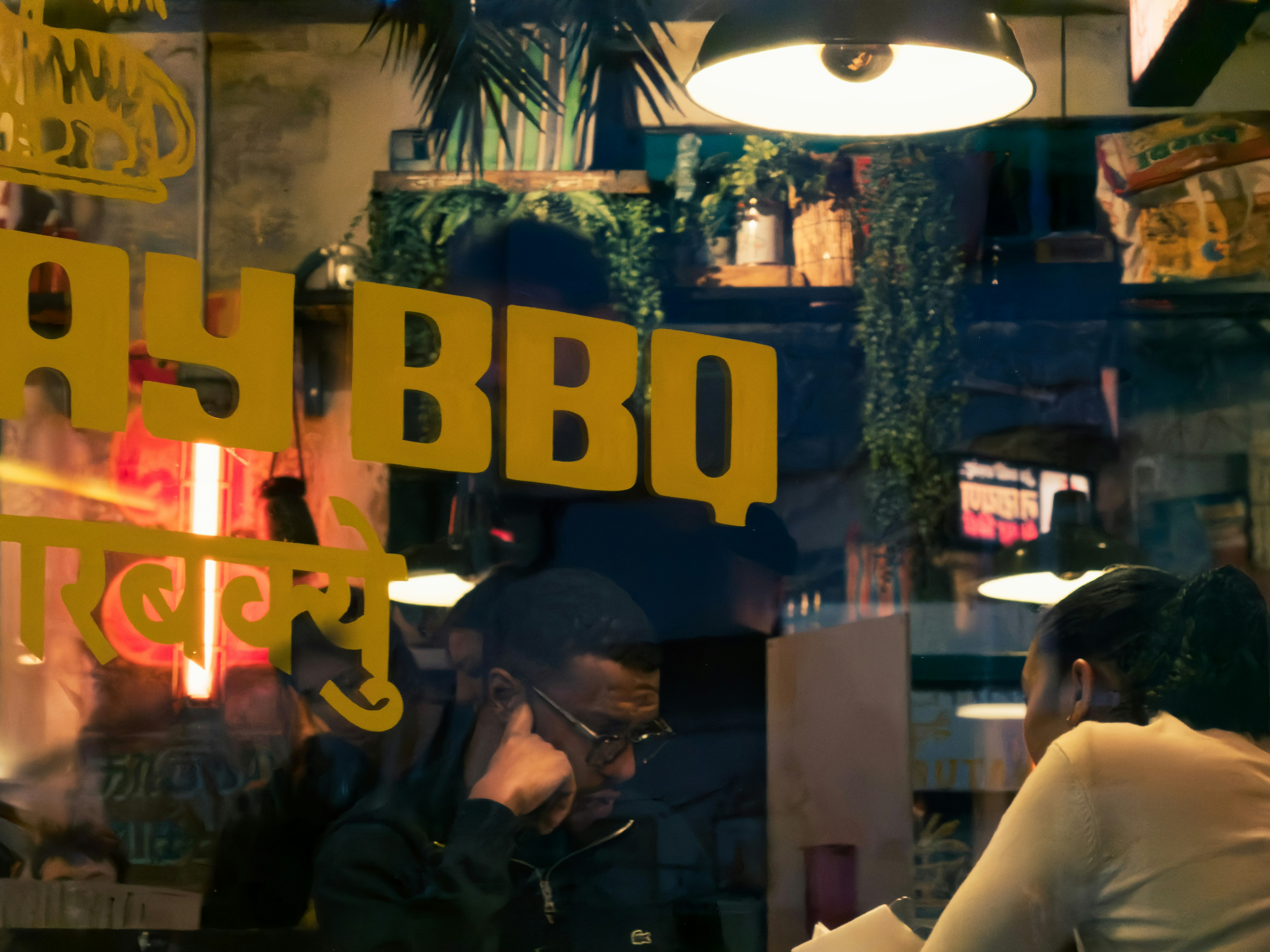 Conversations Over Grilllights: A Quiet Moment by the BBQ Window