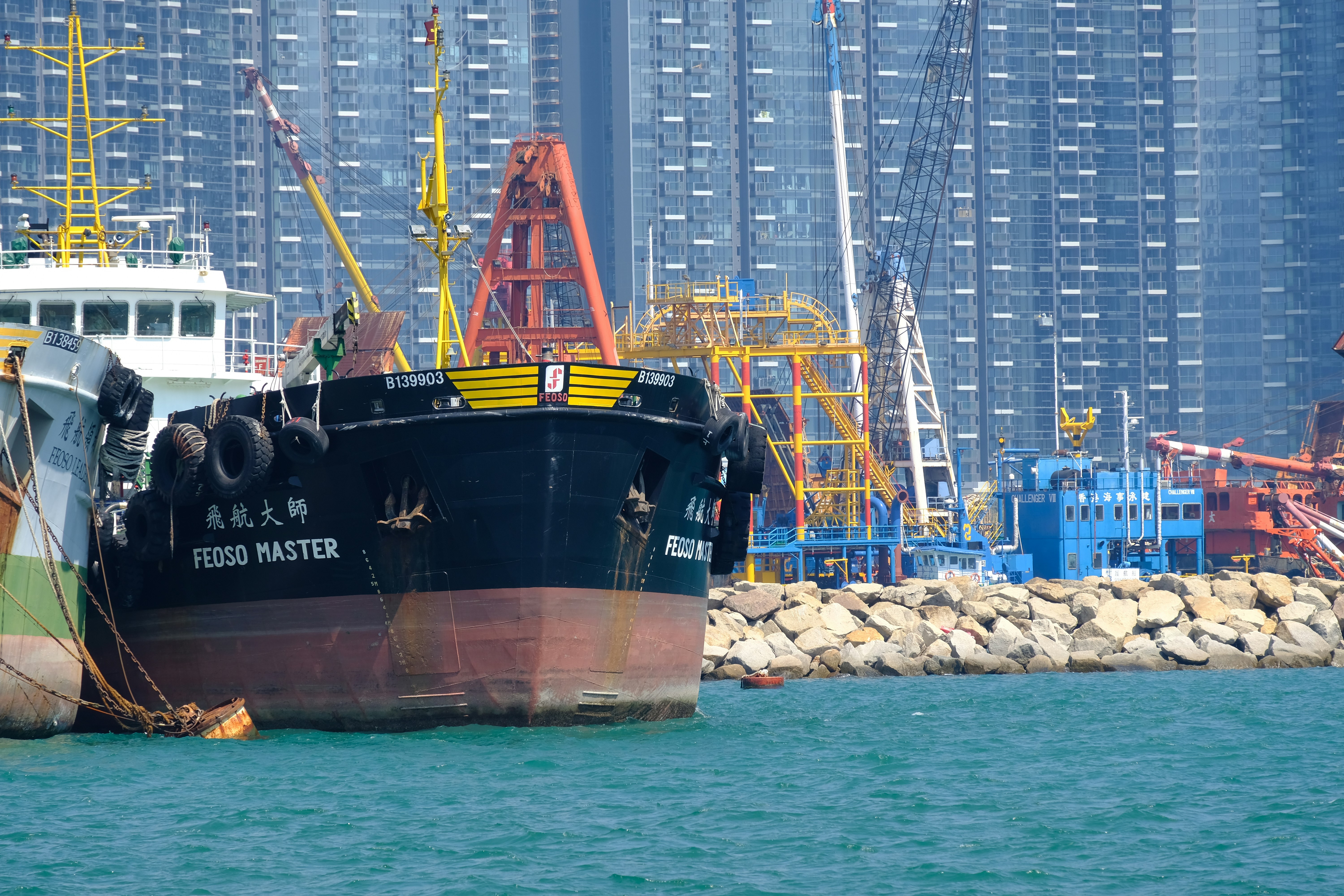 Harbor Vessel with Construction Yard Rising Beyond