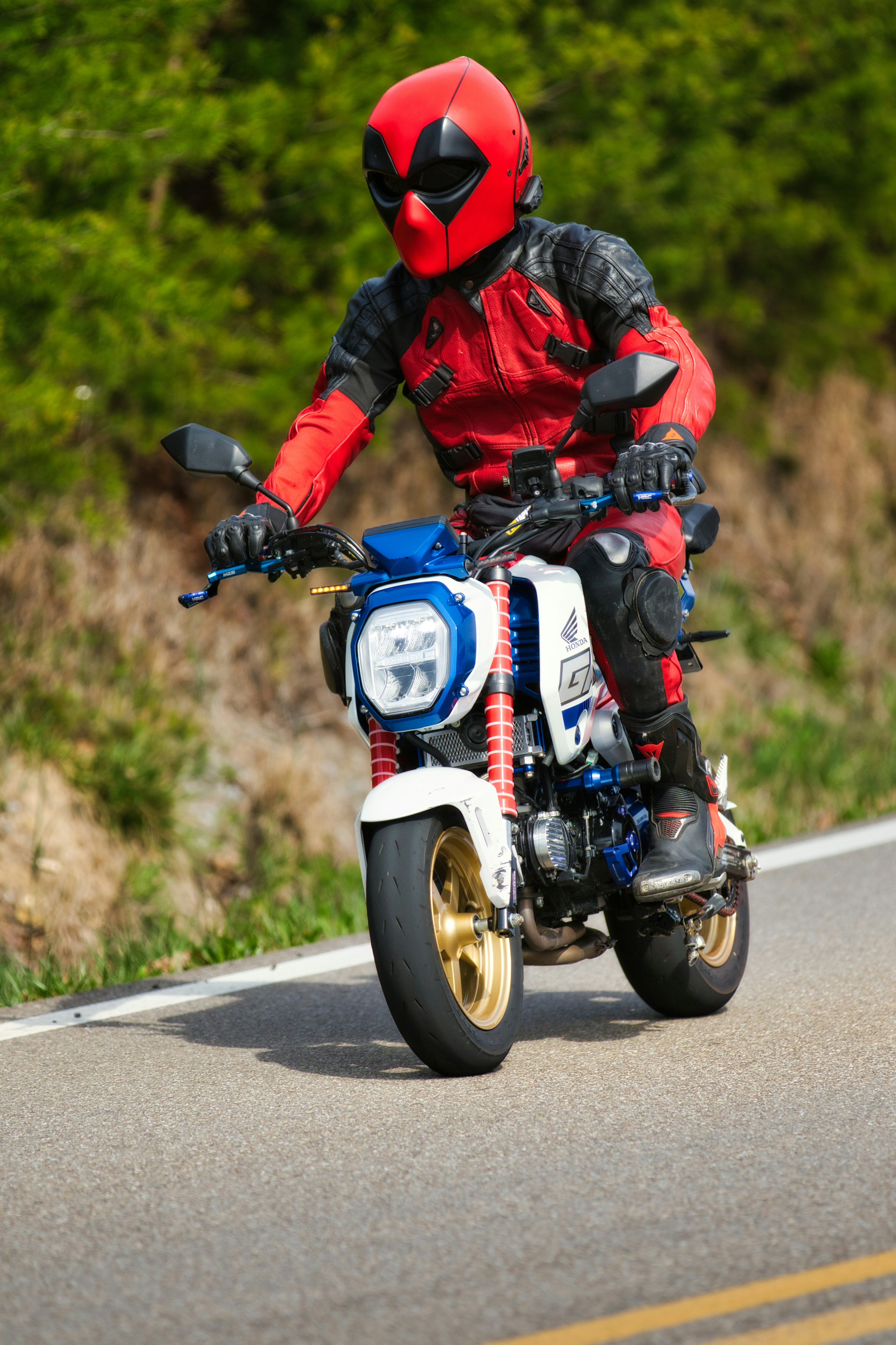 Red Blur on Two Wheels: Deadpool Rides the Sunset Road