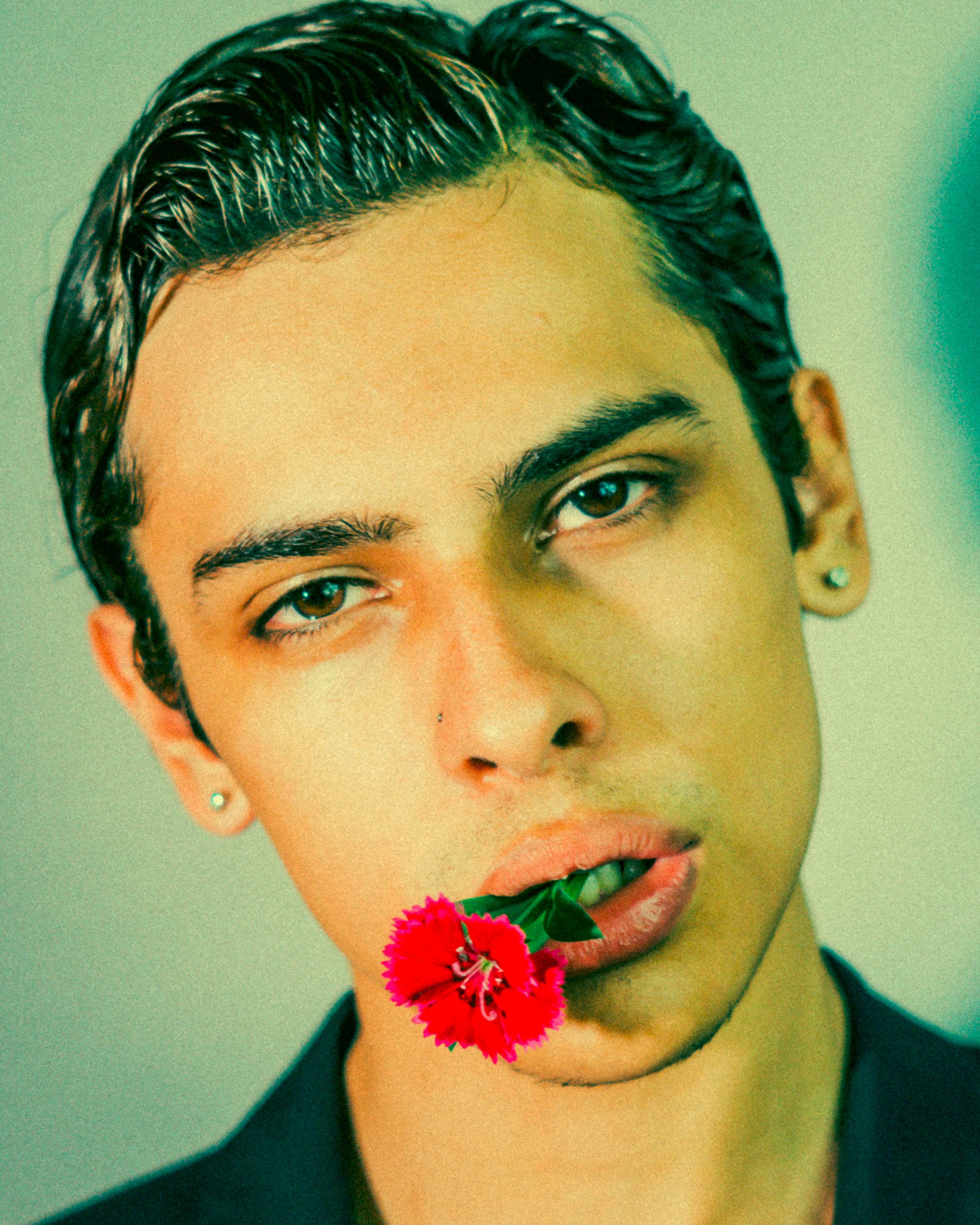 Crimson Blossom: A Leaf-Touched Portrait
