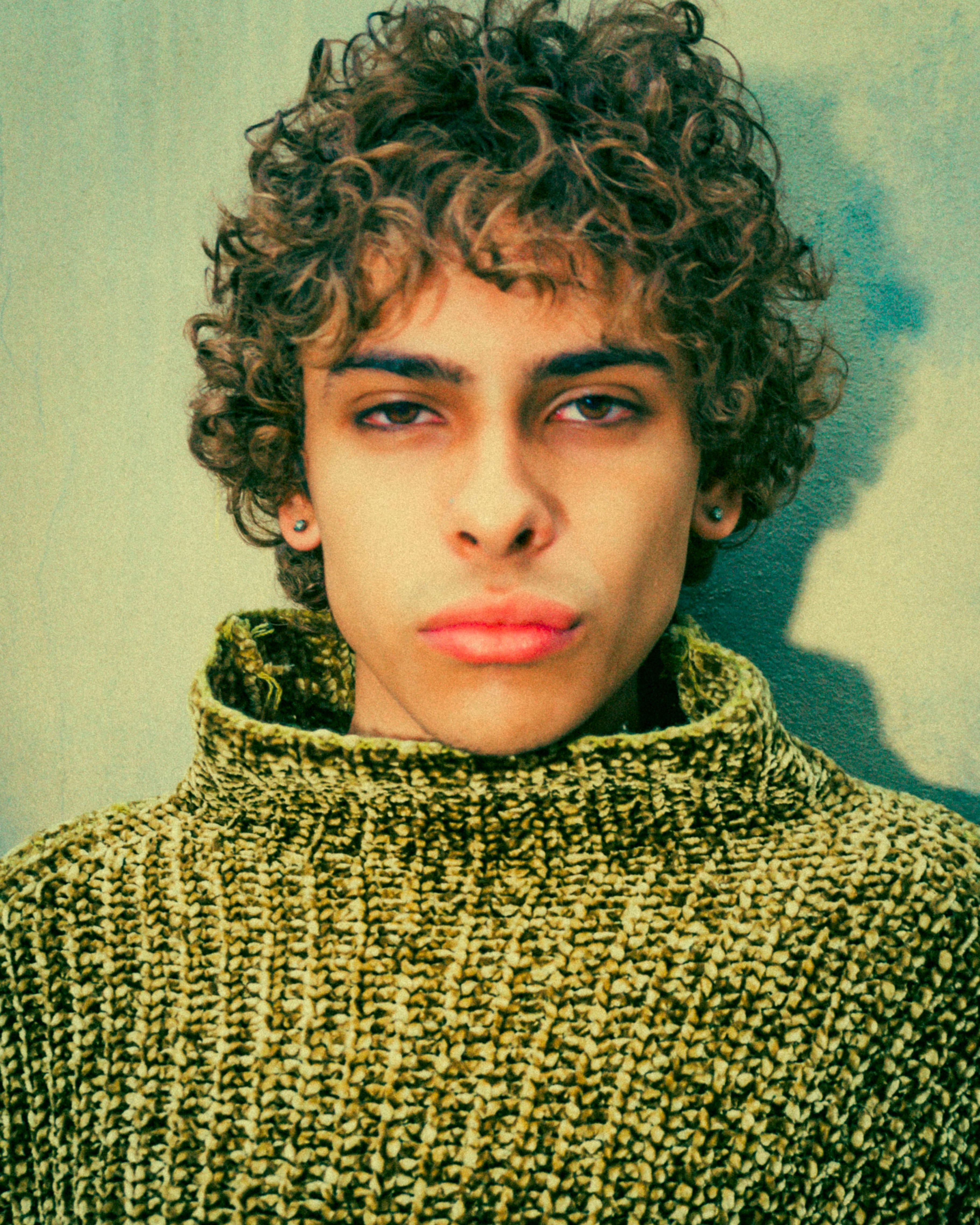 Muted Confidence: Close-Up of a Youthful Portrait in Warm Light