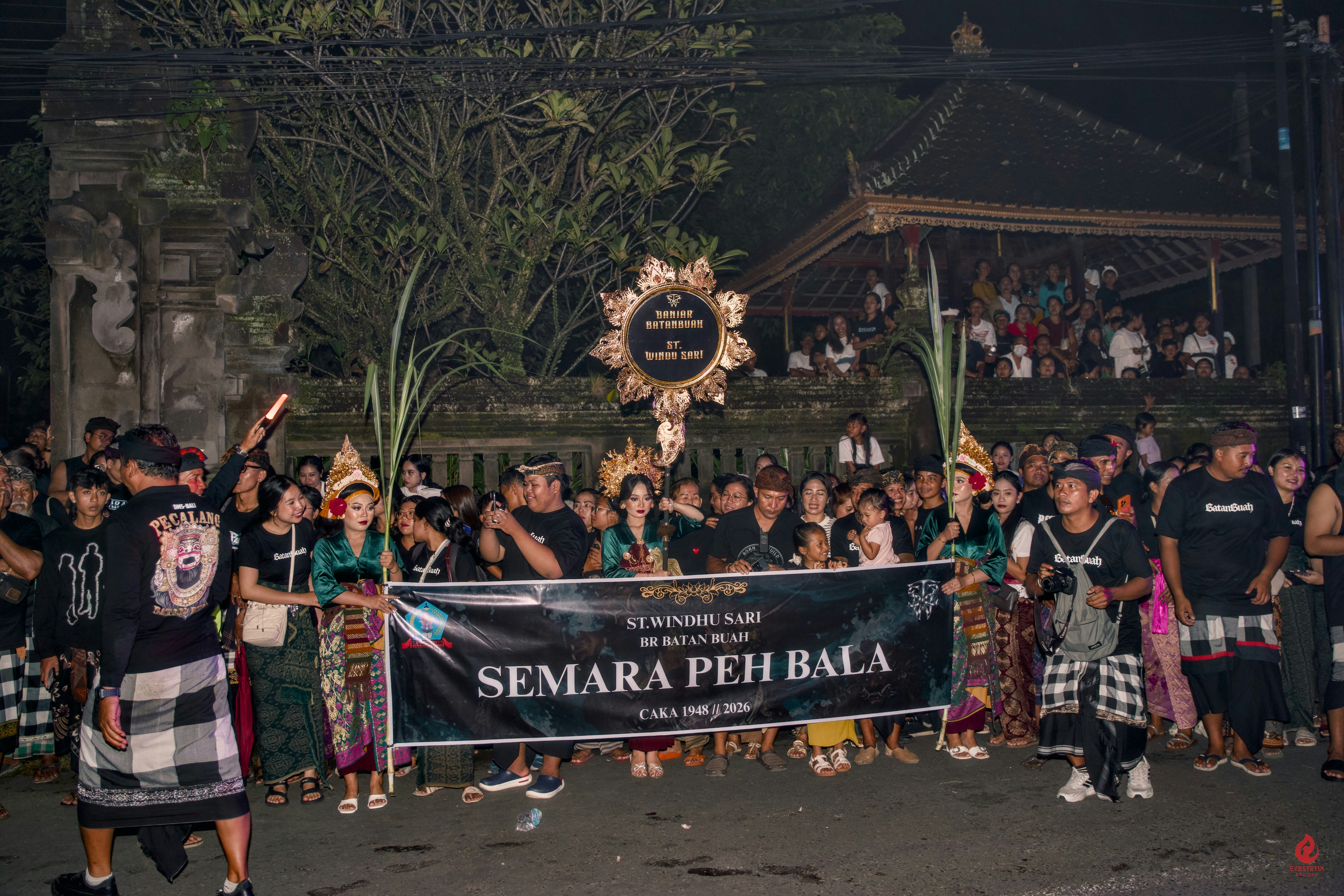 Semara Poh Bali: Night Parade Banner Under Lantern-lit Crowd