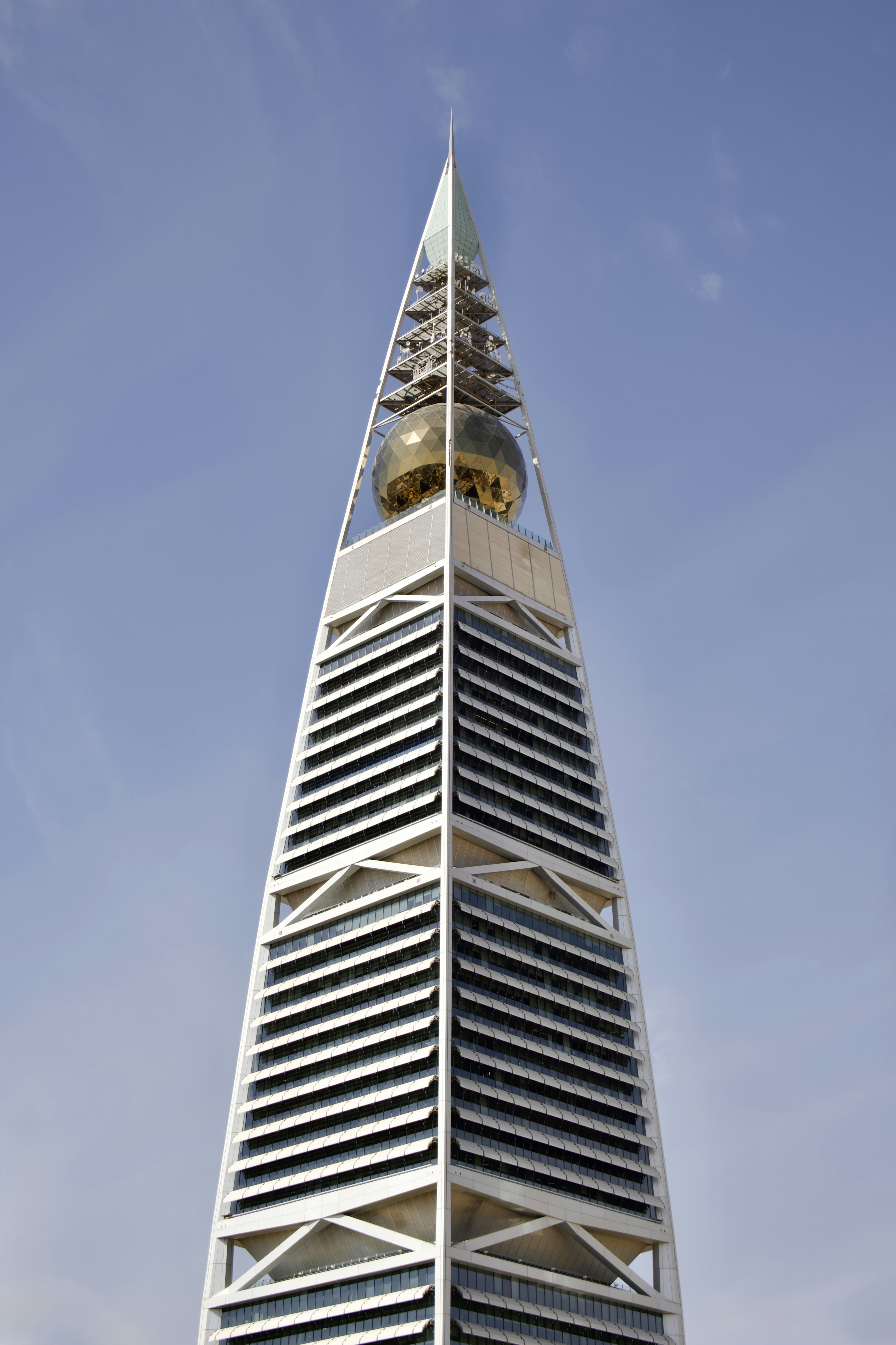 Spire of Precision: The Golden Needle Reaching the Sky