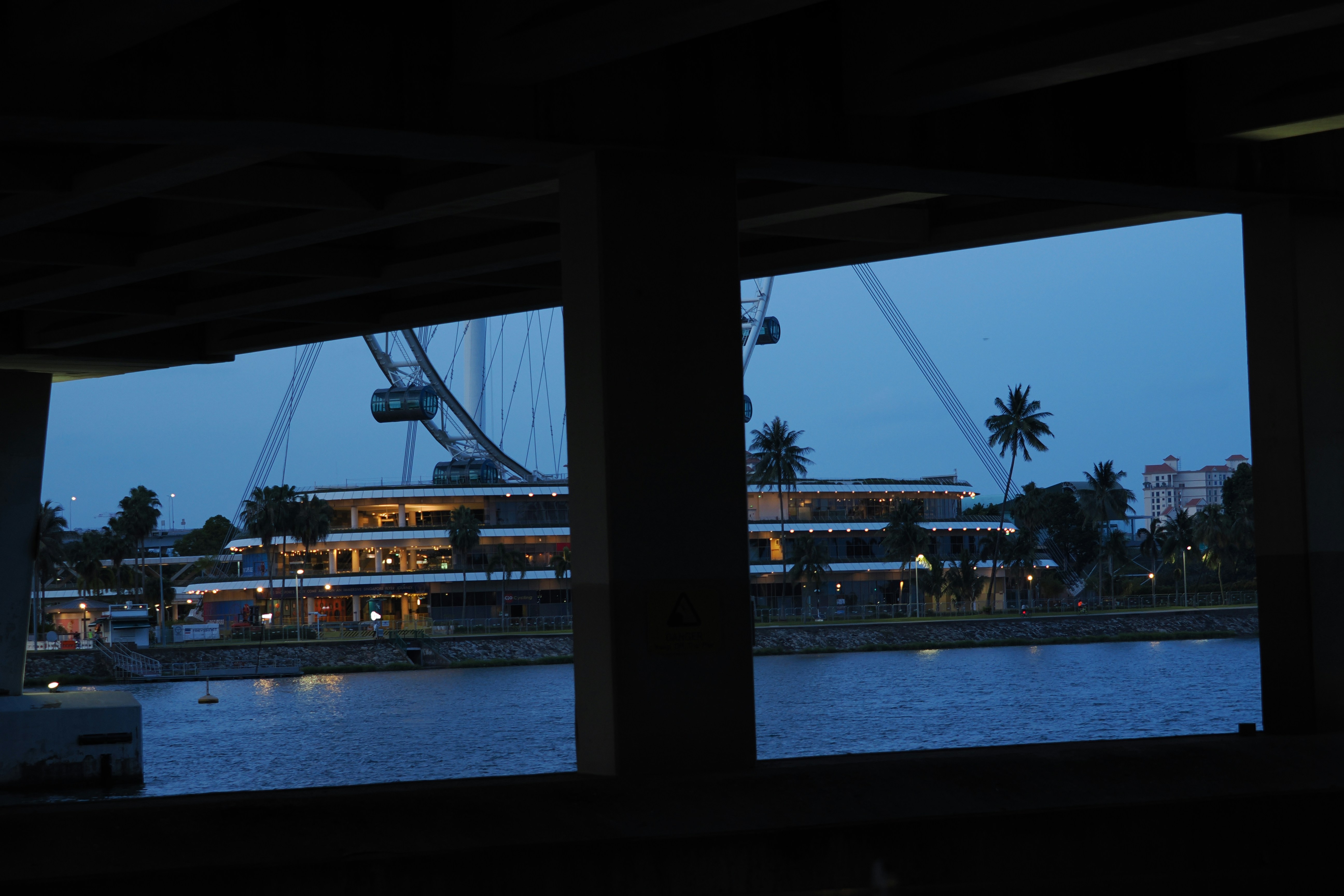 Under the Pier: Nighttime Dockside Glow Beyond the Structural Silhouettes