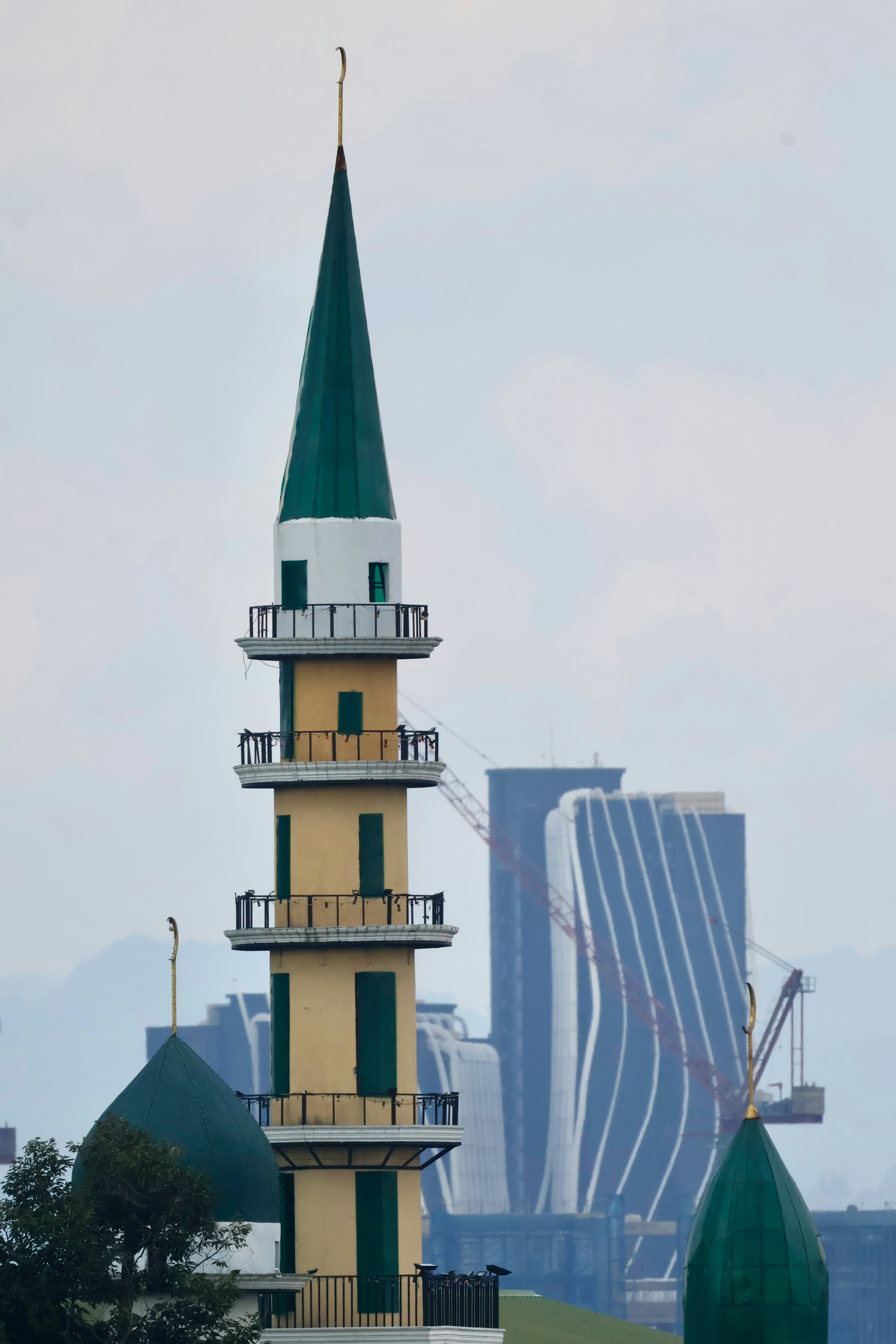 Spire and Skyline: A Towering Tale Against a Modern Cityscape