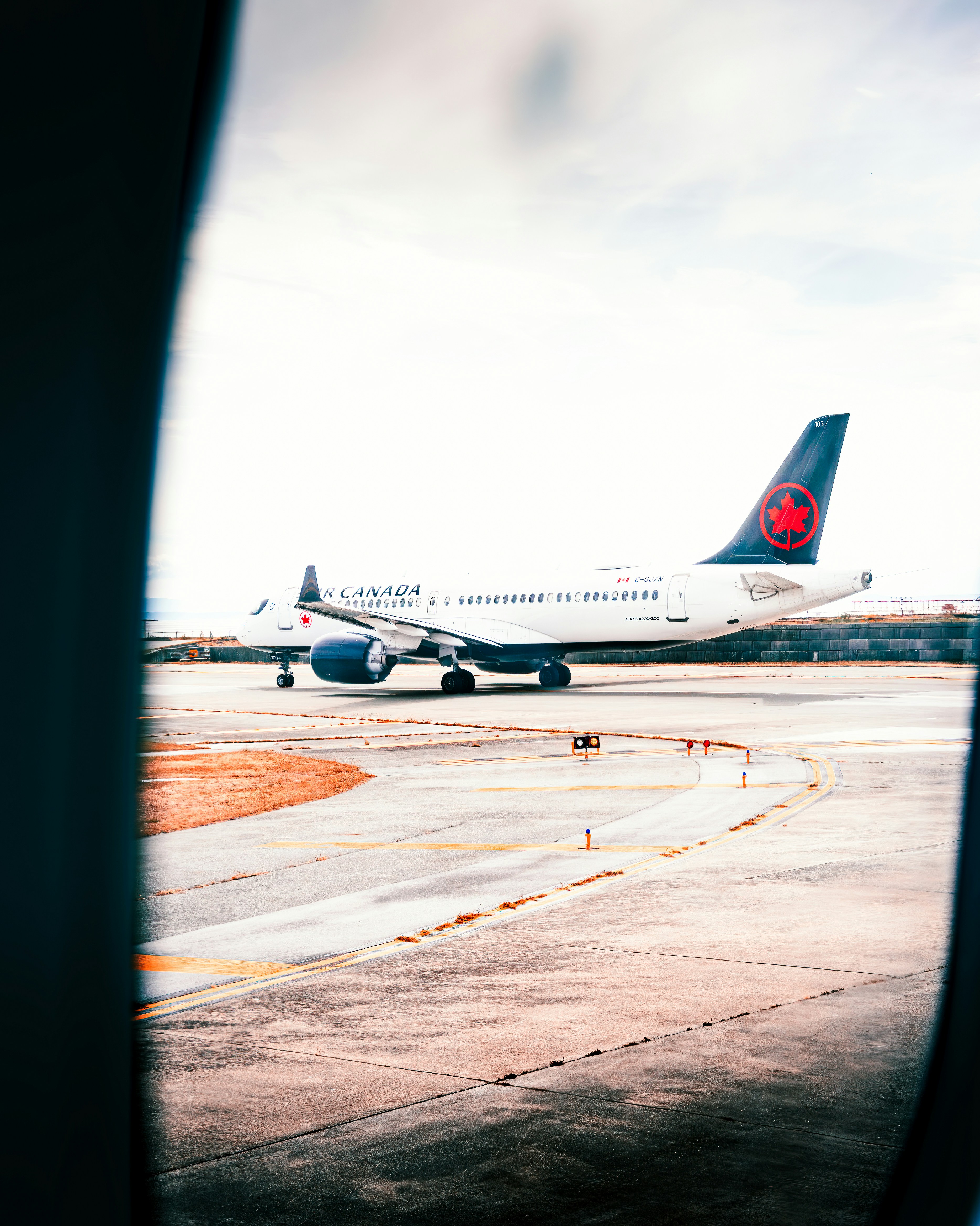 Transcontinental Silhouette: A Canadair Jet at the Gate